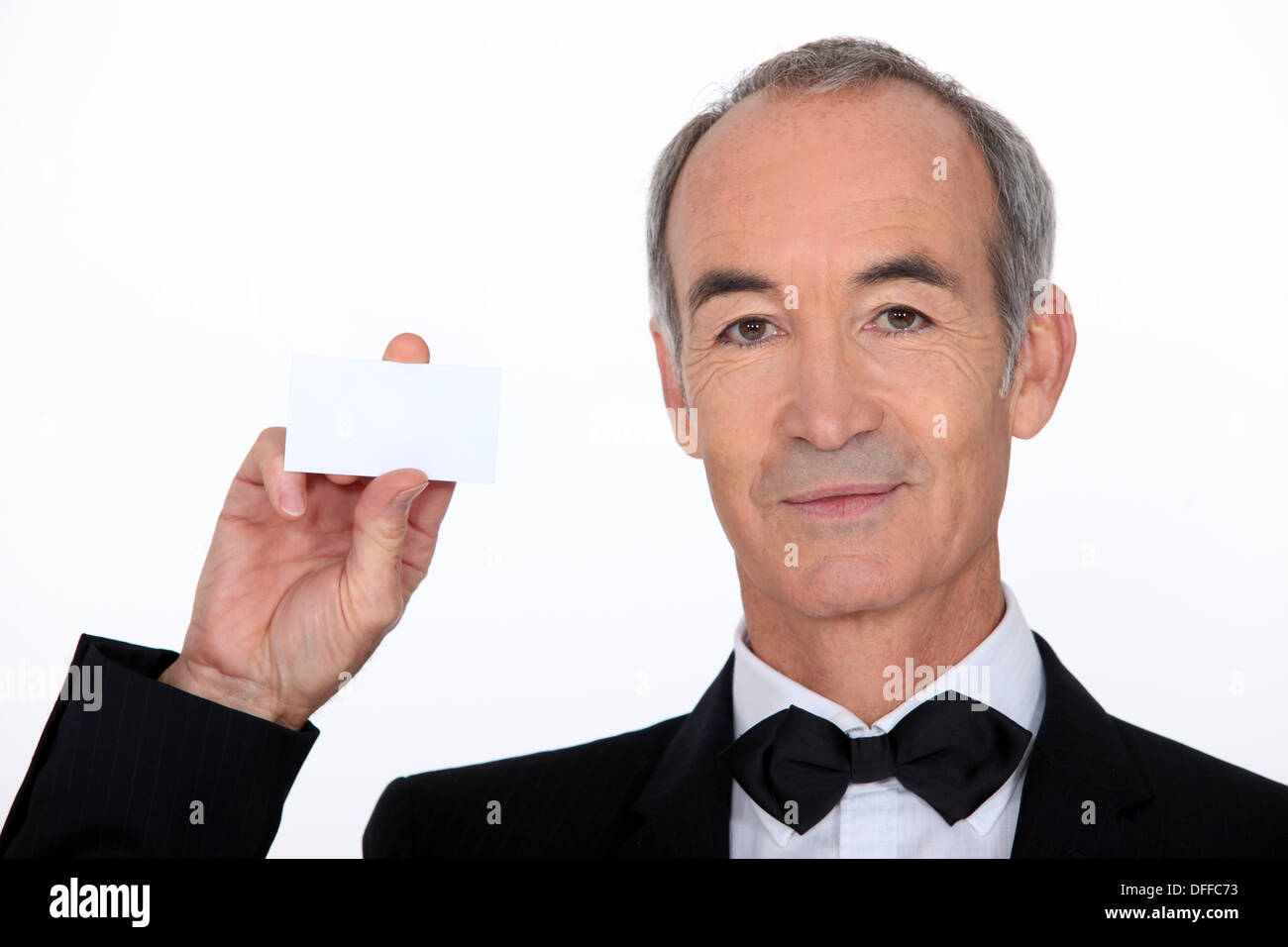 Waiter holding business card Stock Photo - Alamy