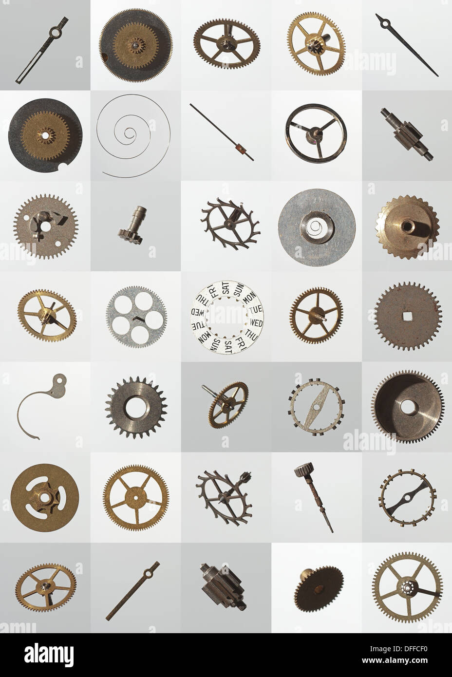 small watch cogs and other parts, looking down from above background ...