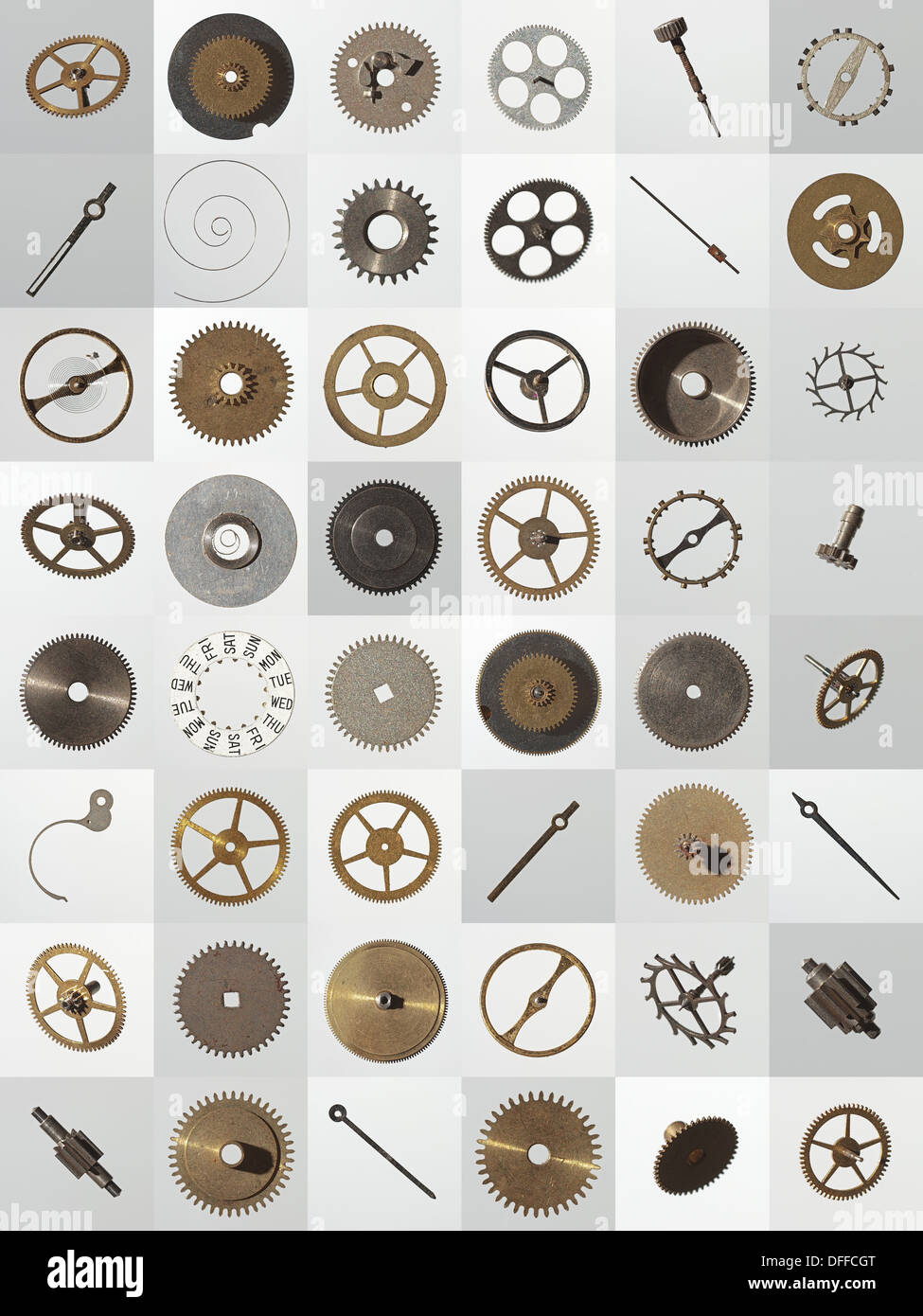 small watch cogs and other parts, looking down from above background ...