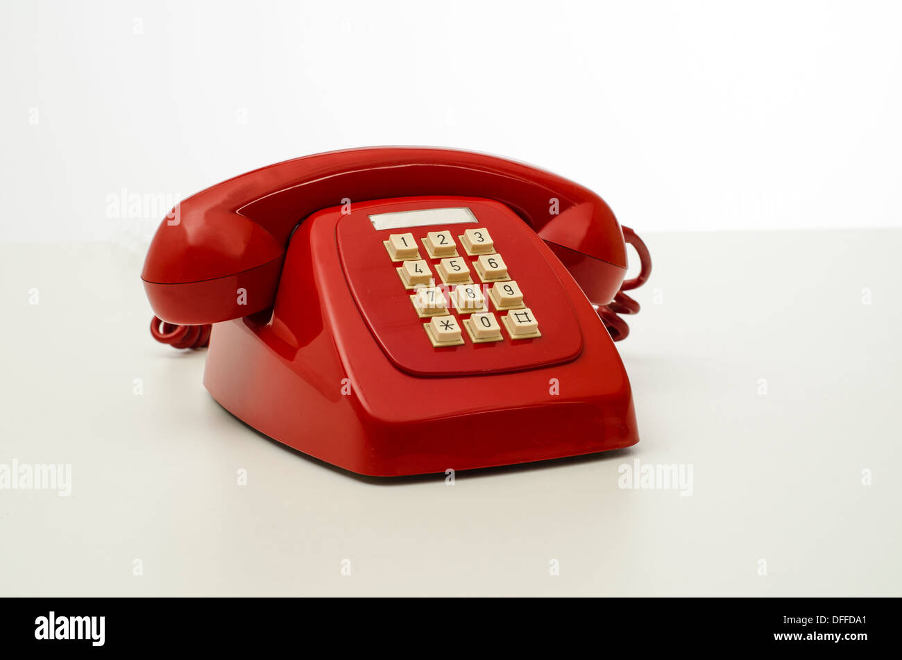Vintage red phone. Studio picture Stock Photo - Alamy