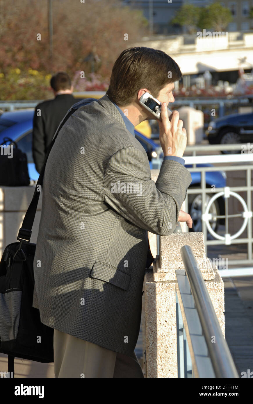 Adult male making a business call on his cellular telephone Stock Photo ...