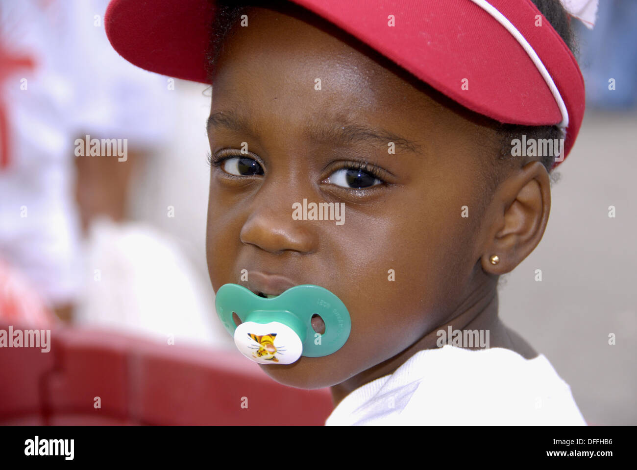 Portrait of a baby girl sucking a pacifier hi-res stock photography and ...