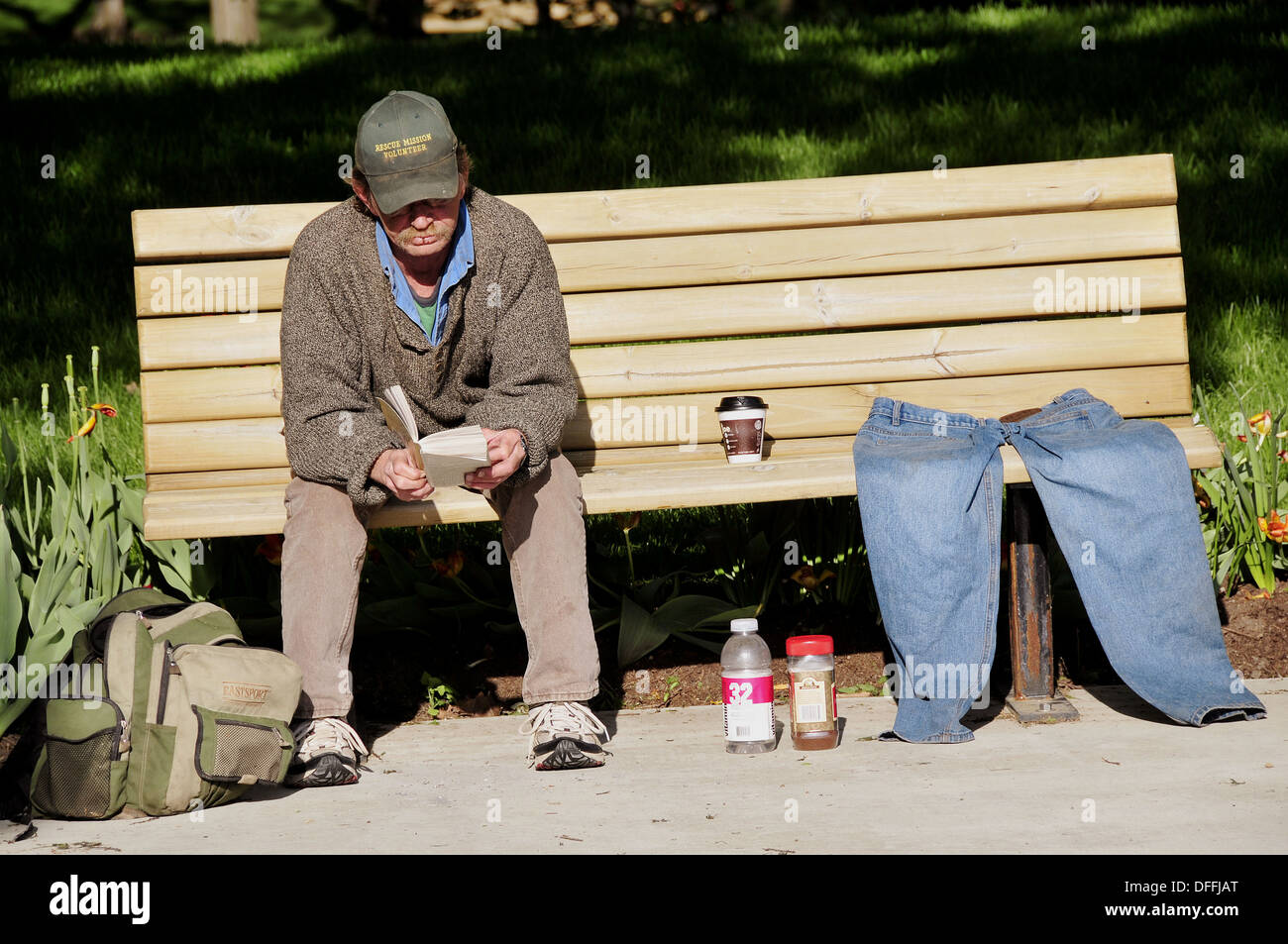 Homeless man reading book in hi-res stock photography and images - Alamy