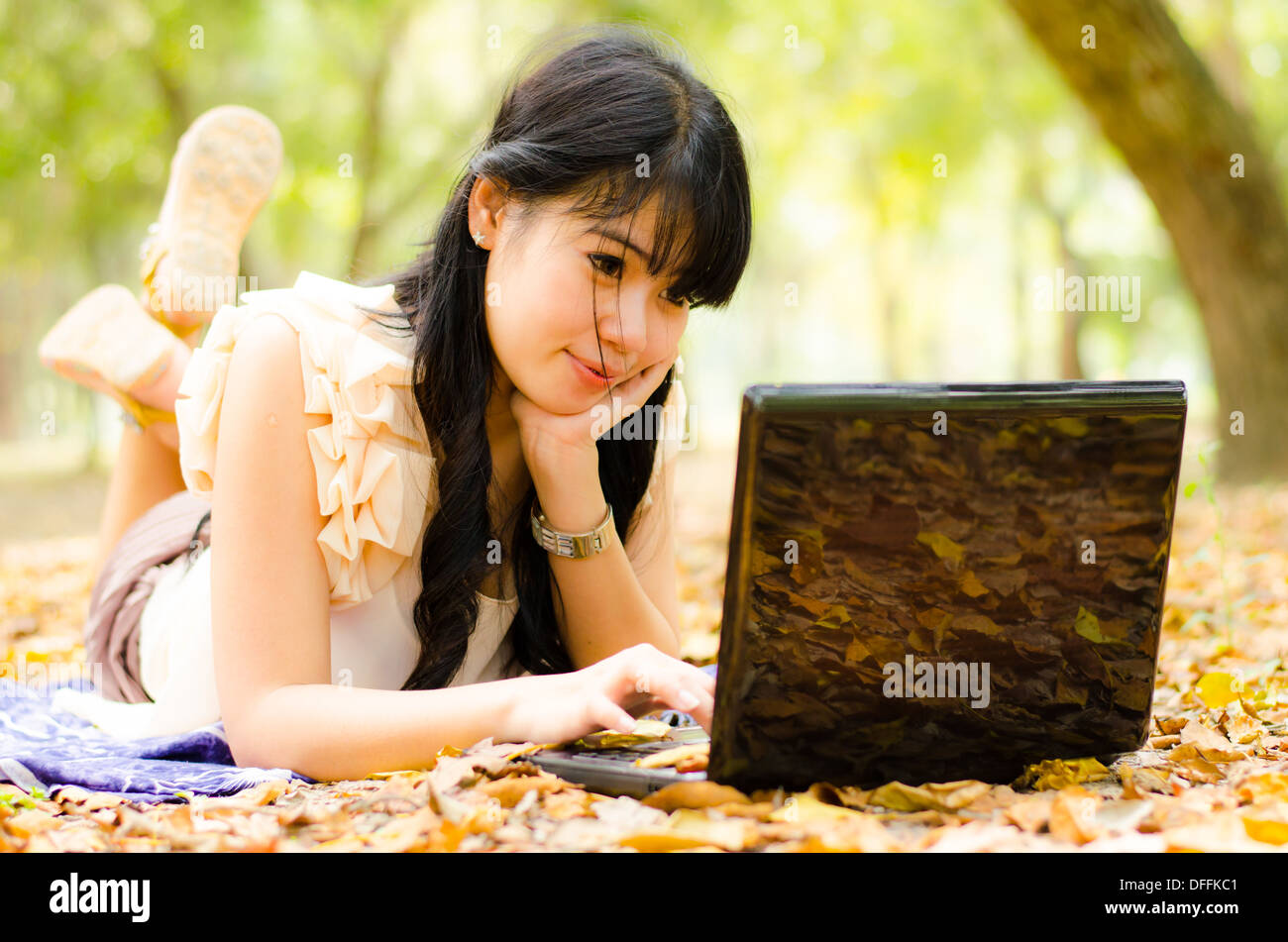 Black women with laptop in park hi-res stock photography and images - Alamy