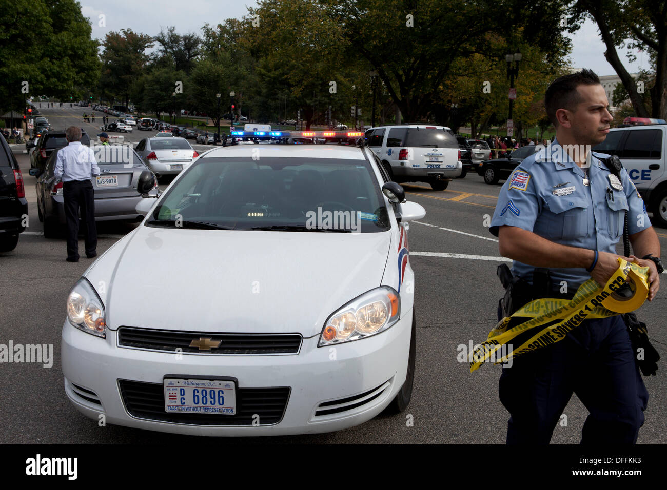 Policeman taping off crime scene - Washington, DC USA Stock Photo - Alamy