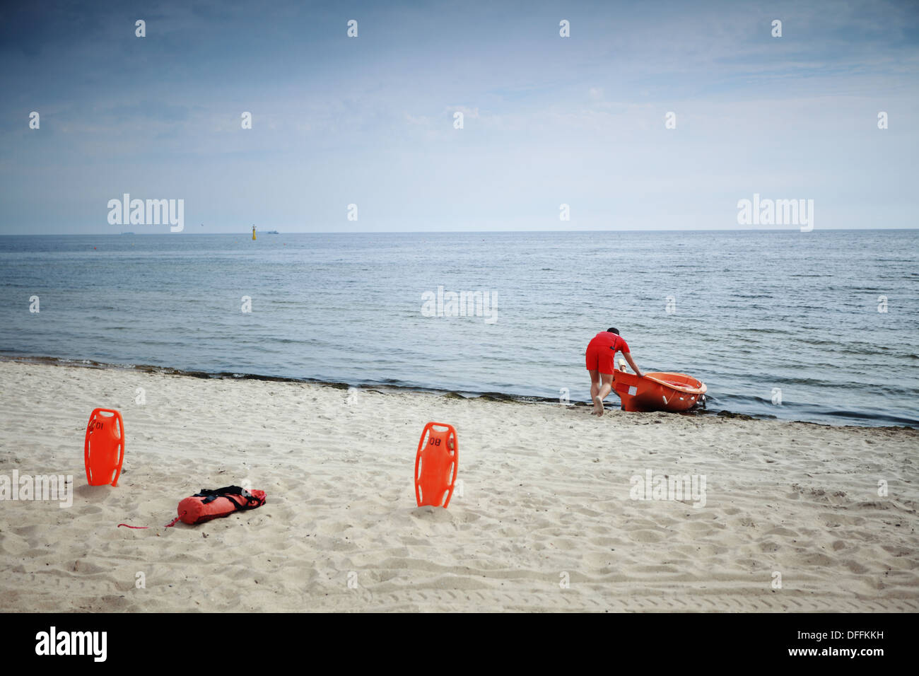 Beach life-saving. Lifeguard rescue equipment orange preserver tool and ...