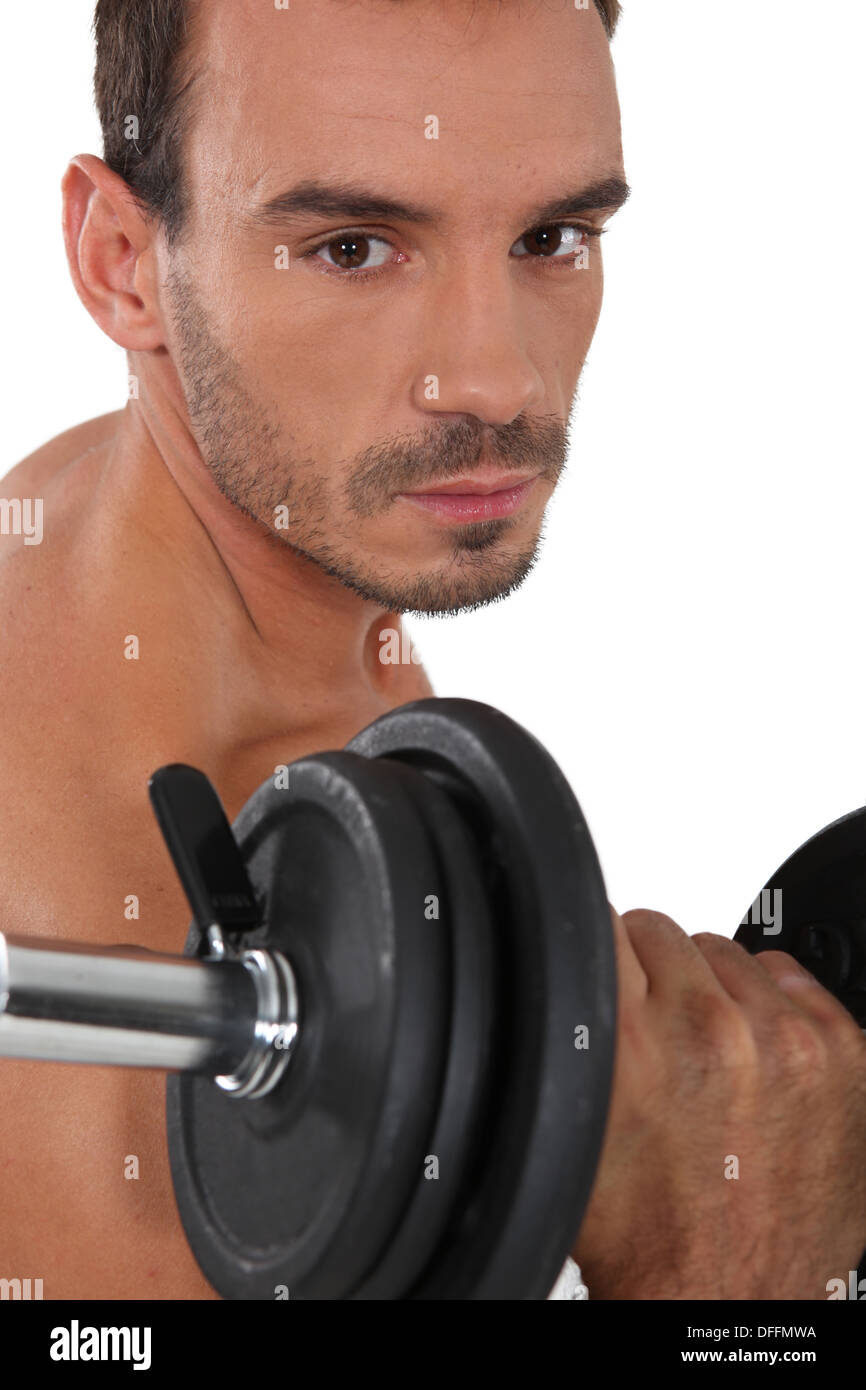 Man lifting weights Stock Photo - Alamy
