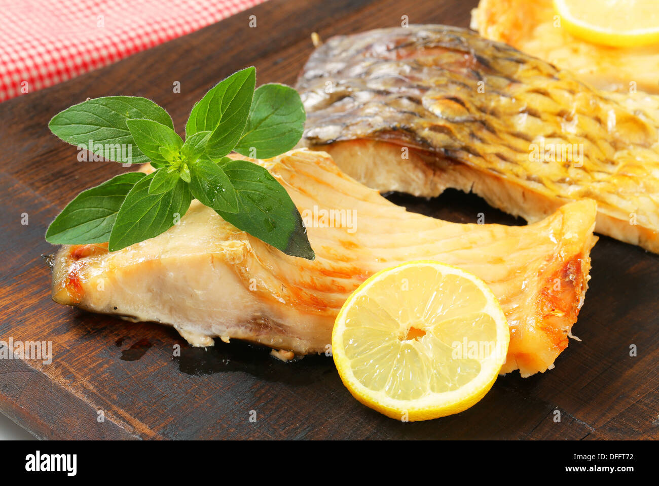 Oven baked carp fillet with lemon and dill Stock Photo - Alamy