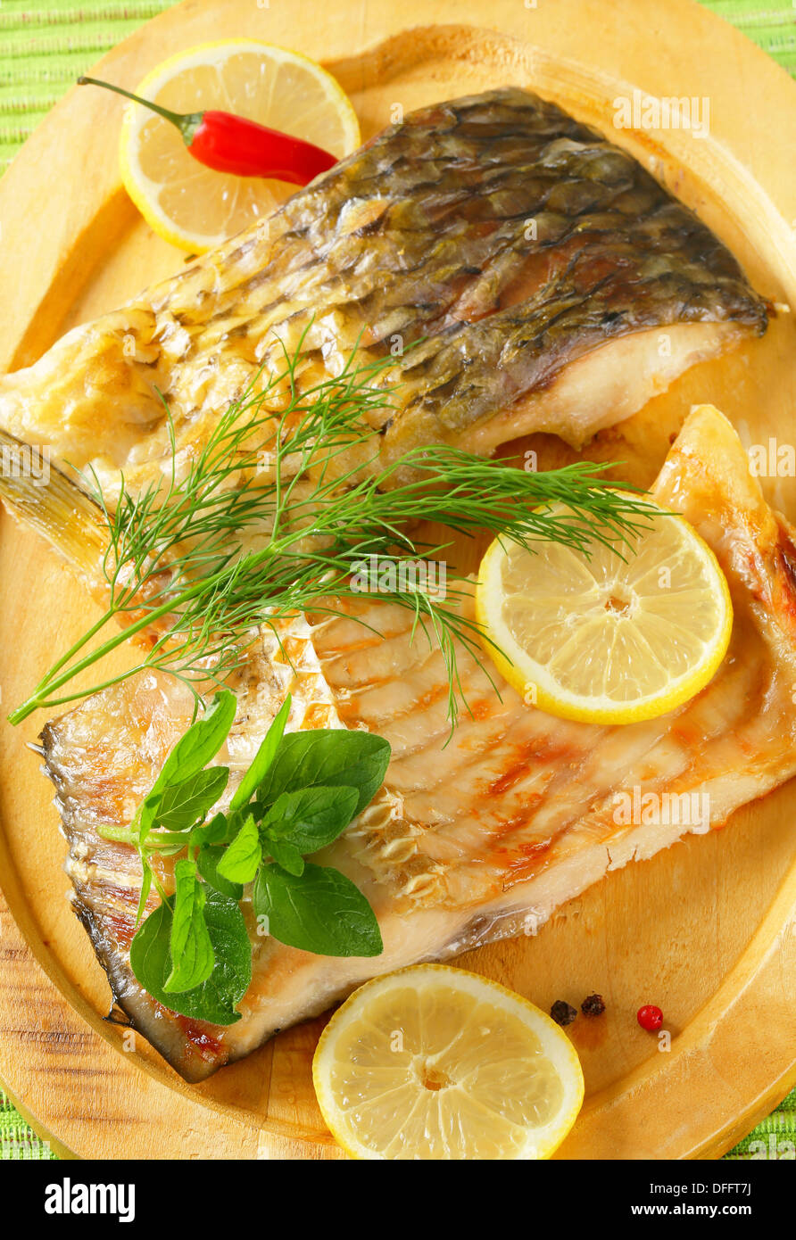 Oven baked carp fillet with lemon and dill Stock Photo - Alamy