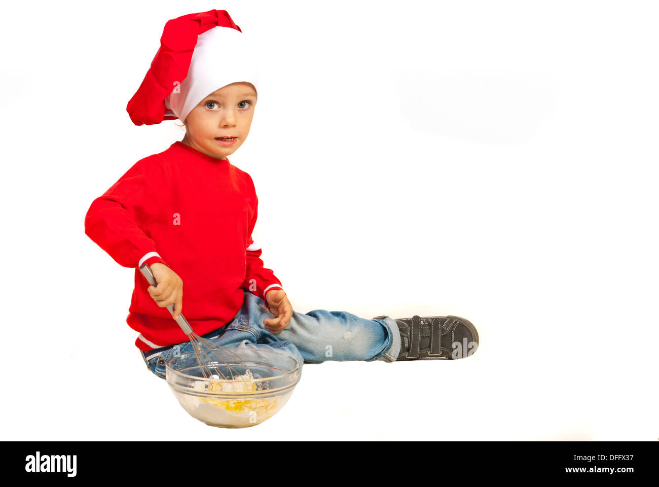 Happy toddler chef boy with ingredients to make pizza dough Stock Photo ...