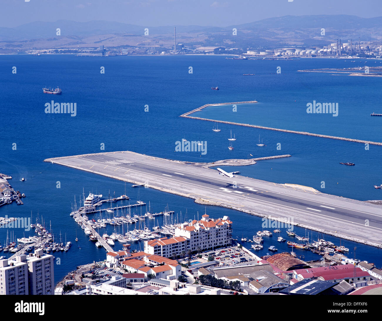 Elevated view of airport runway with the Spanish coastline to the rear ...