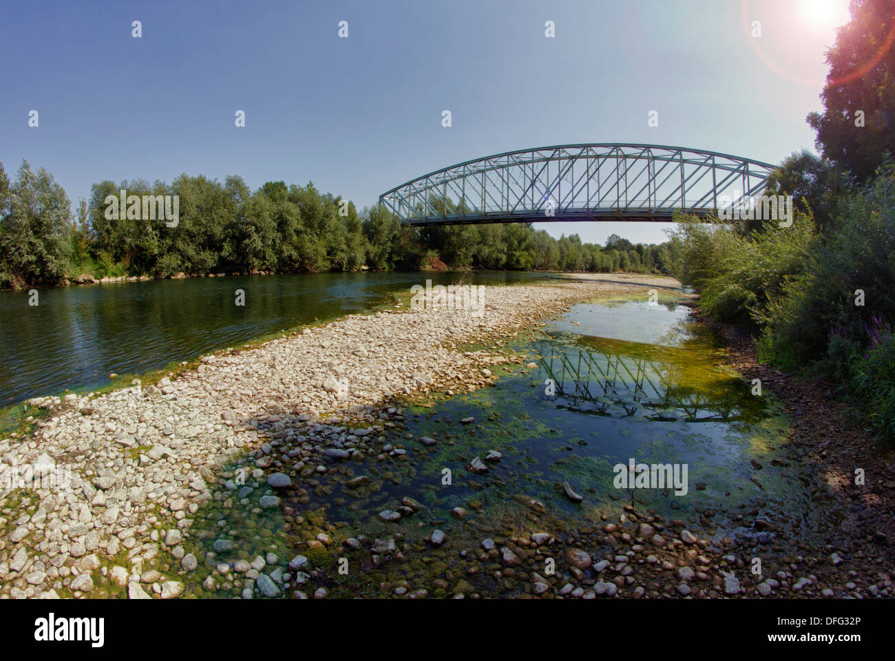 Iron bridge with river Krka in Slovenia, flowing under it Stock Photo - Alamy
