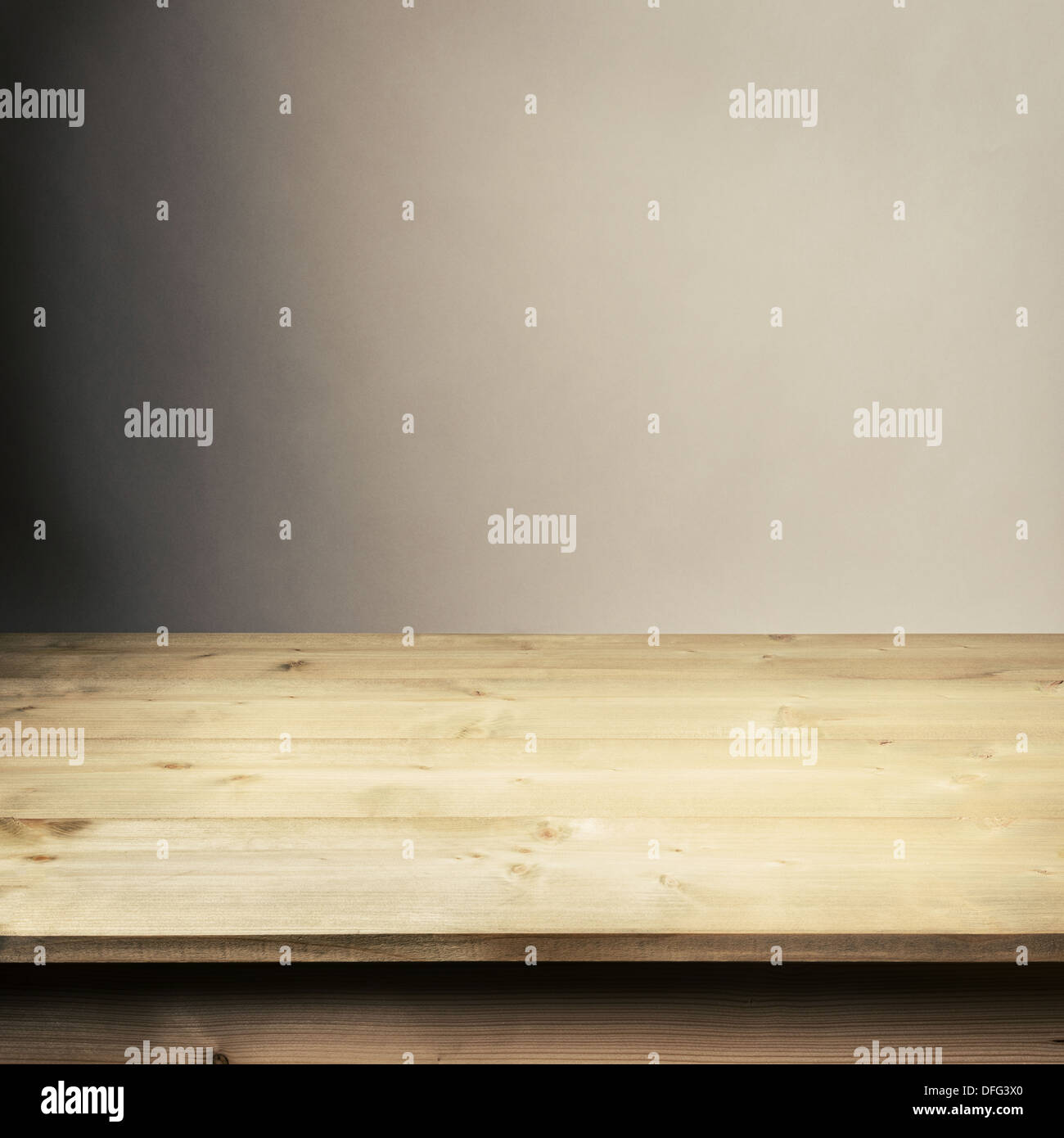 Wooden table in front of wall Stock Photo - Alamy
