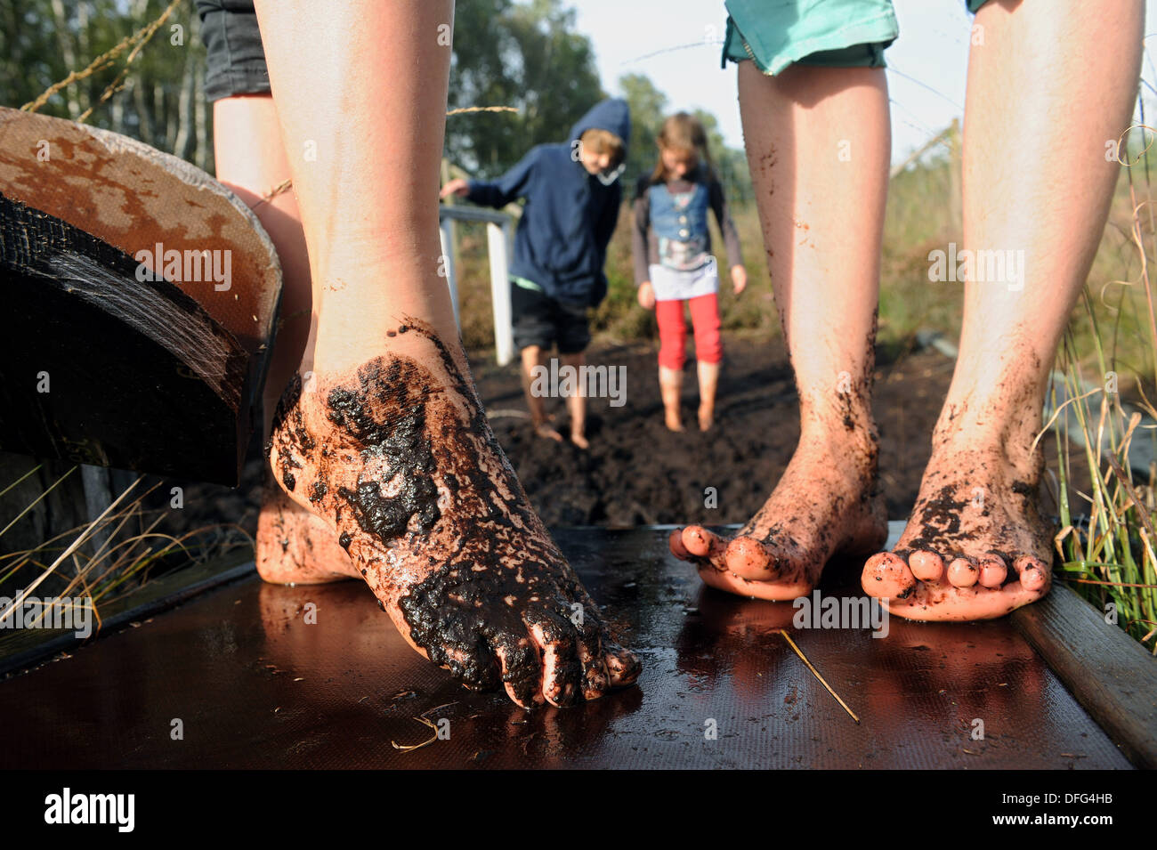 Esterwegen, Germany. 03rd Oct, 2013. Children walk with dirty feet on ...
