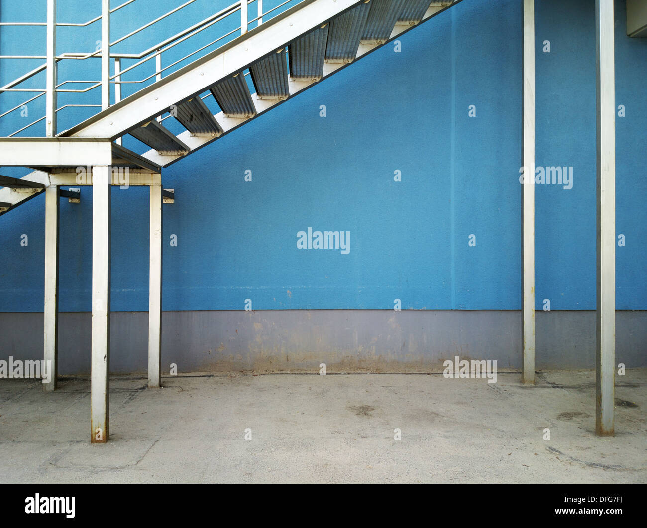 Wall background under metal staircase Stock Photo - Alamy