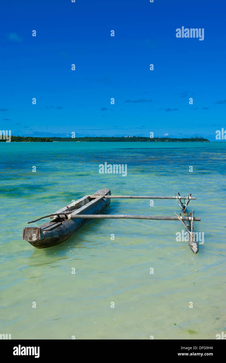 Outrigger in the turquoise waters, Île des Pins, New Caledonia, France ...