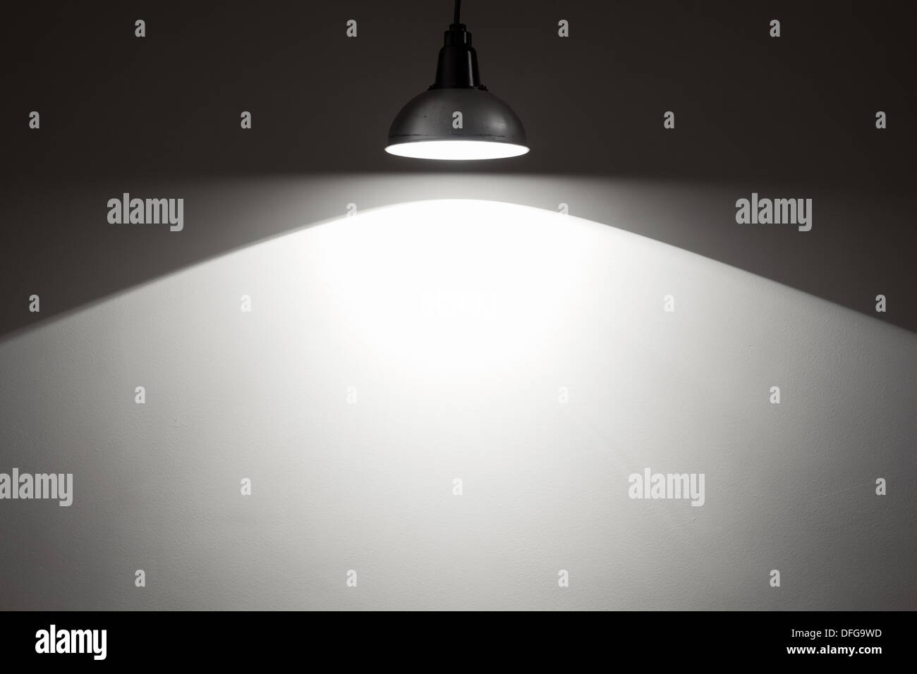 Spotlight on empty wall Stock Photo - Alamy