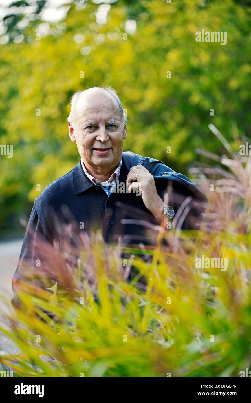 Typical pensioner in a park in autumn Stock Photo - Alamy