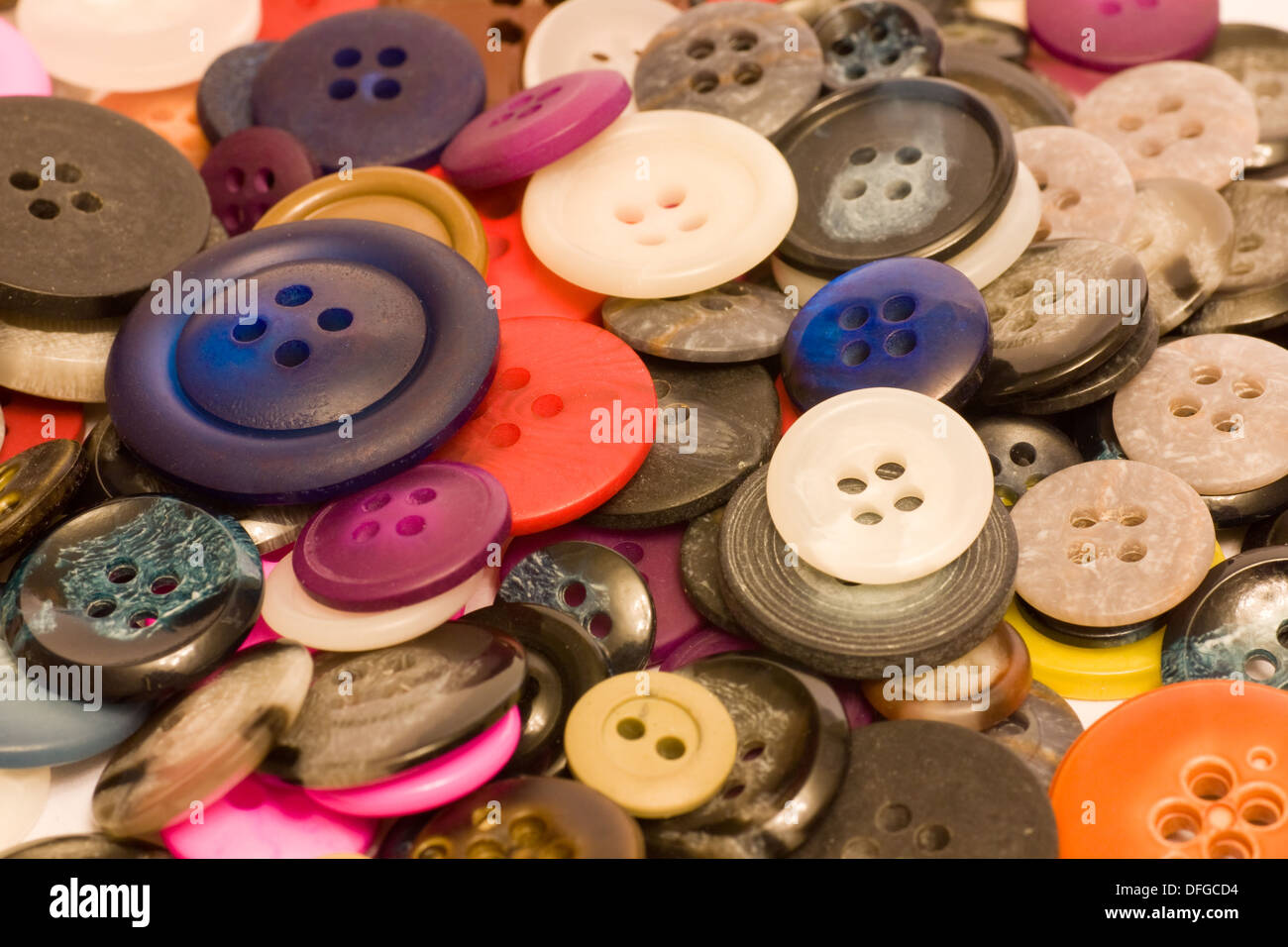 A variety of different sizes and colors of buttons Stock Photo - Alamy