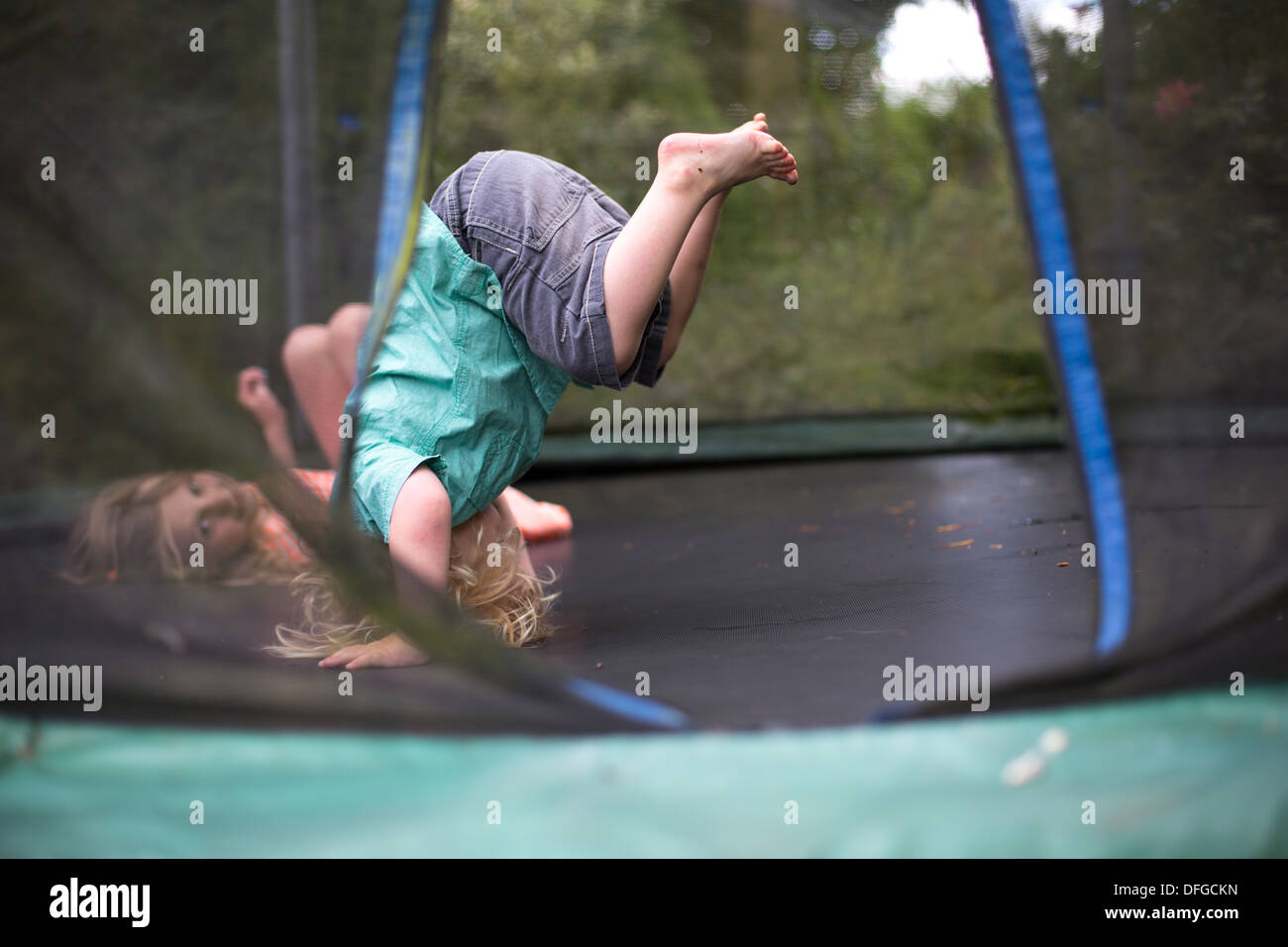 Children playing on a Trampoline Stock Photo - Alamy