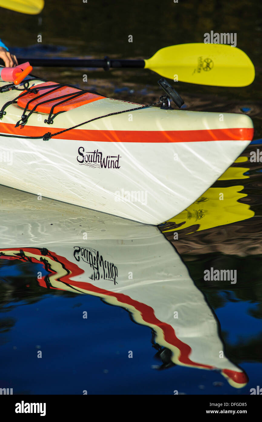 Bow of kayak reflecting in water Stock Photo - Alamy