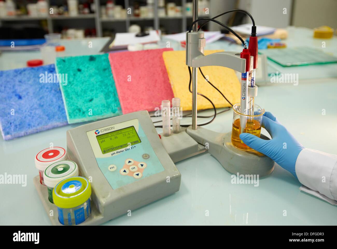 Selective electrode pH meter and samples of coloured cement for study ...