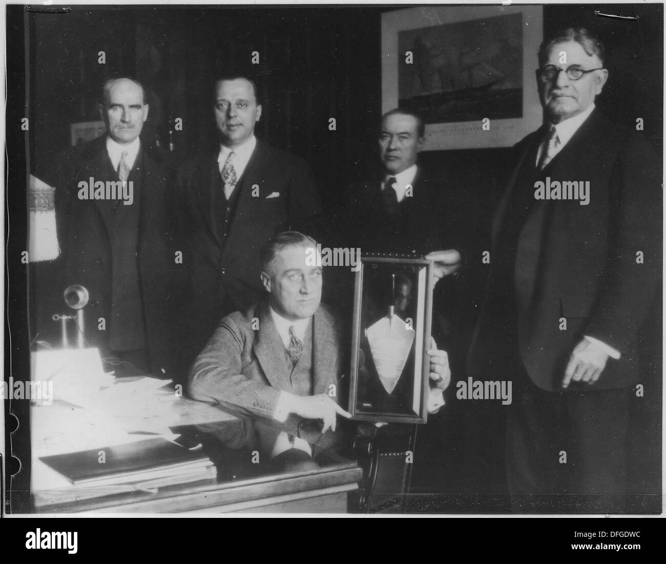 Franklin D. Roosevelt is seen with four men in Albany, New York, during ...