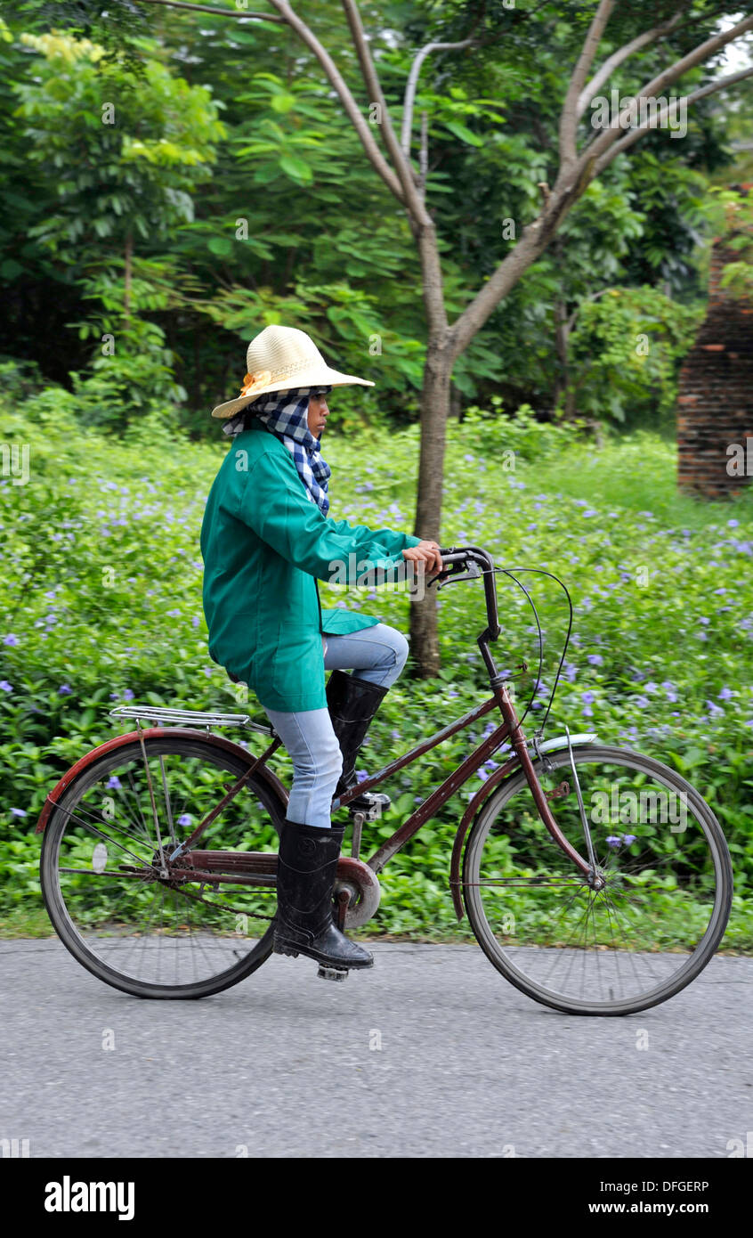 Thai worker cycling Stock Photo - Alamy