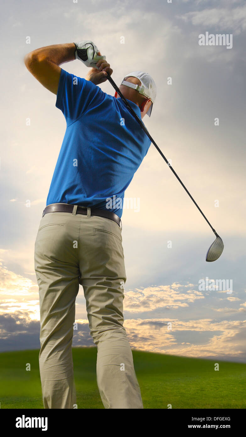Photograph of a golfer finishing a full swing Stock Photo - Alamy