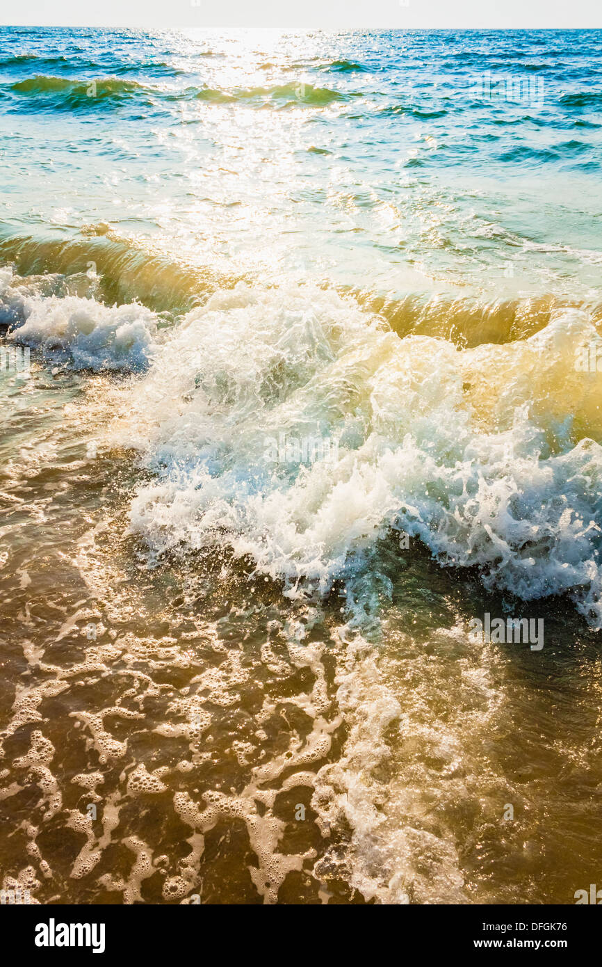 Soft sea ocean waves wash over sand background. Sunset, sunrise Stock ...