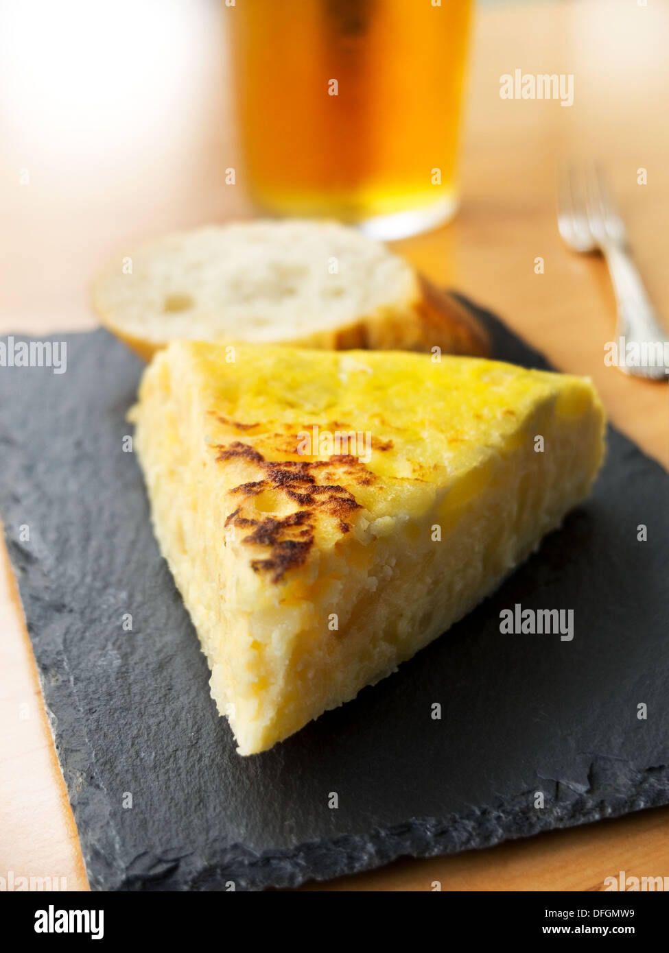 Typical spanish pincho de tortilla de patatas in slate plate Stock ...
