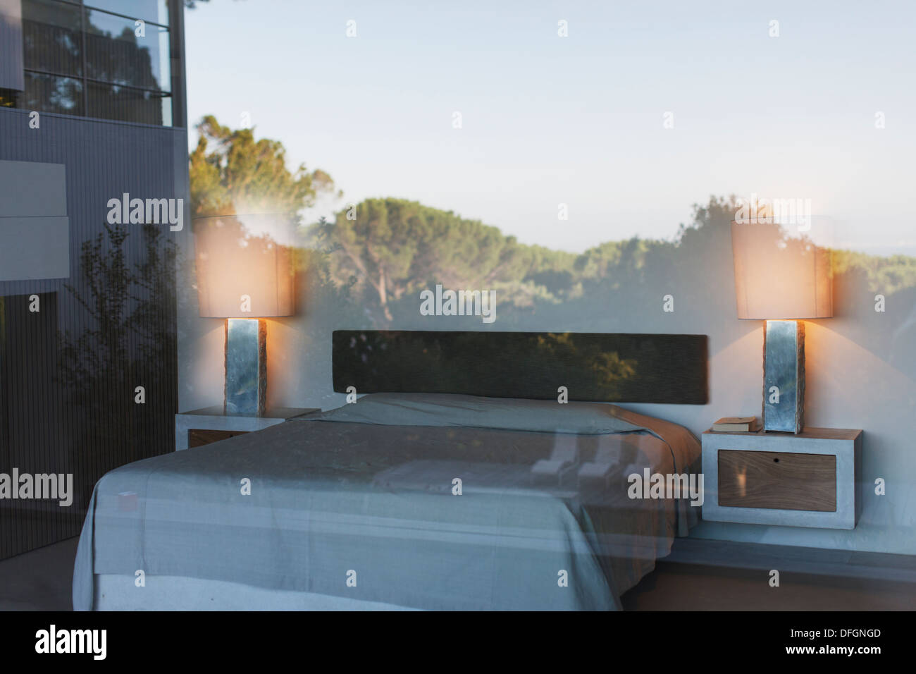 Reflection of trees on modern bedroom window Stock Photo - Alamy
