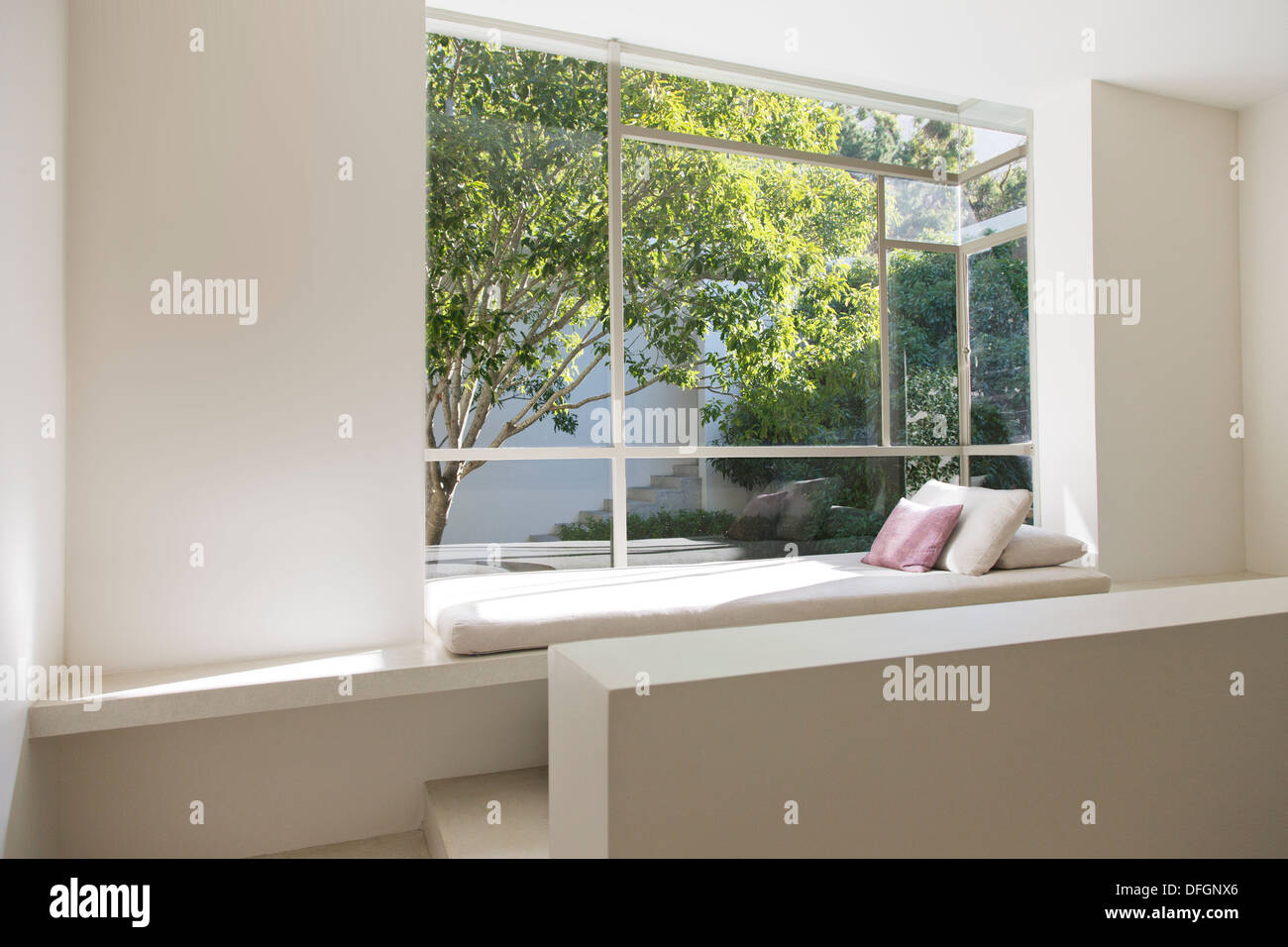Window seat overlooking trees Stock Photo - Alamy