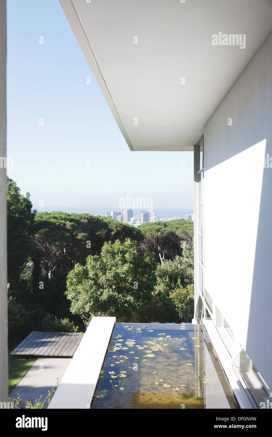 Modern house overlooking city in distance Stock Photo - Alamy