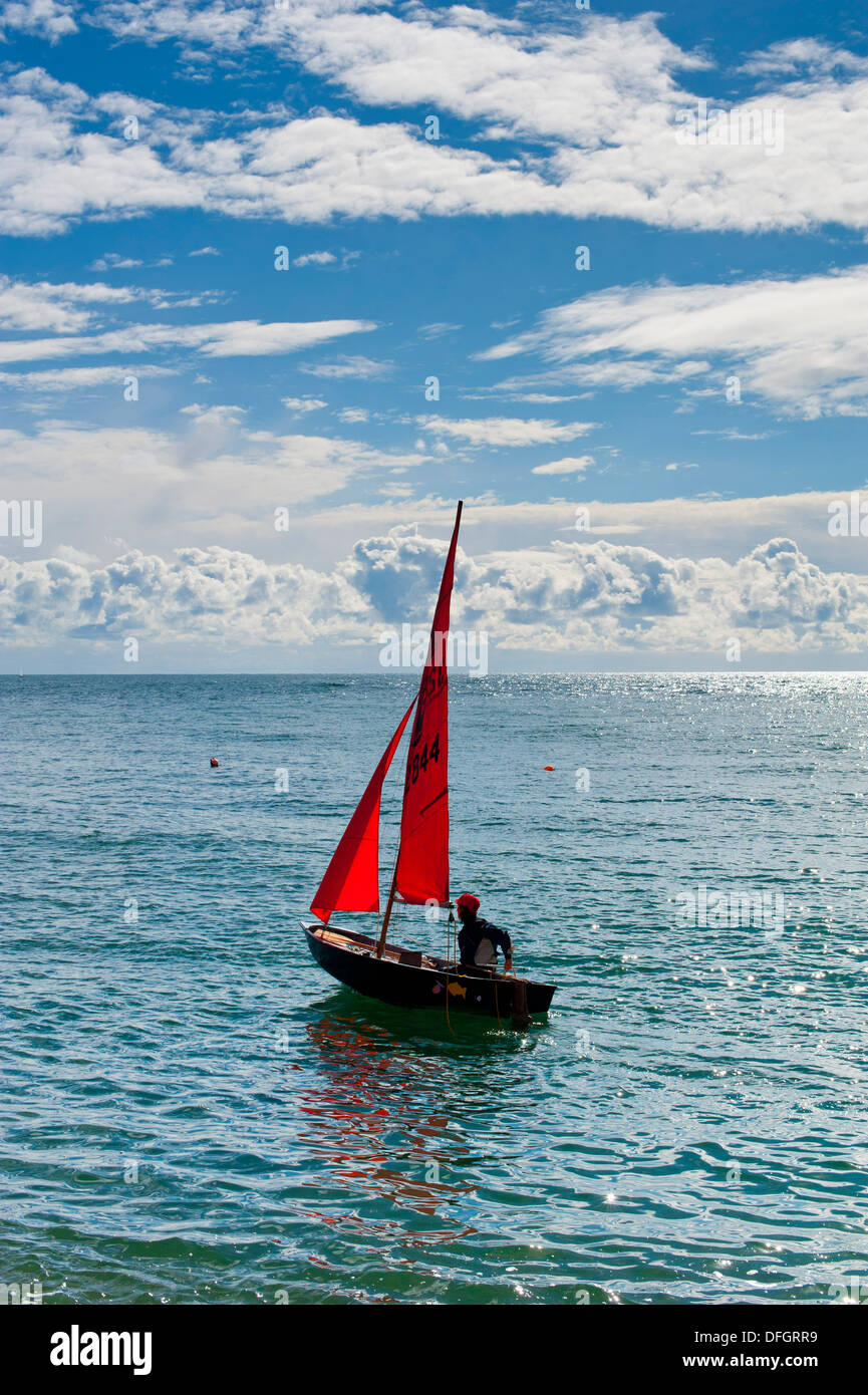 Sailing boat with red sails at Beer Devon England Stock Photo - Alamy