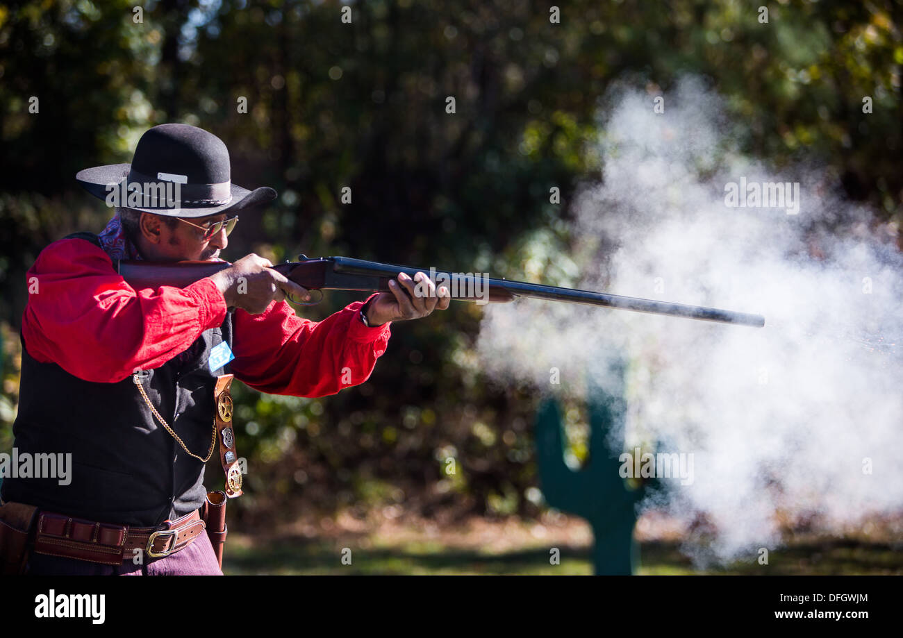 Cowboy at single action gun competition Stock Photo - Alamy