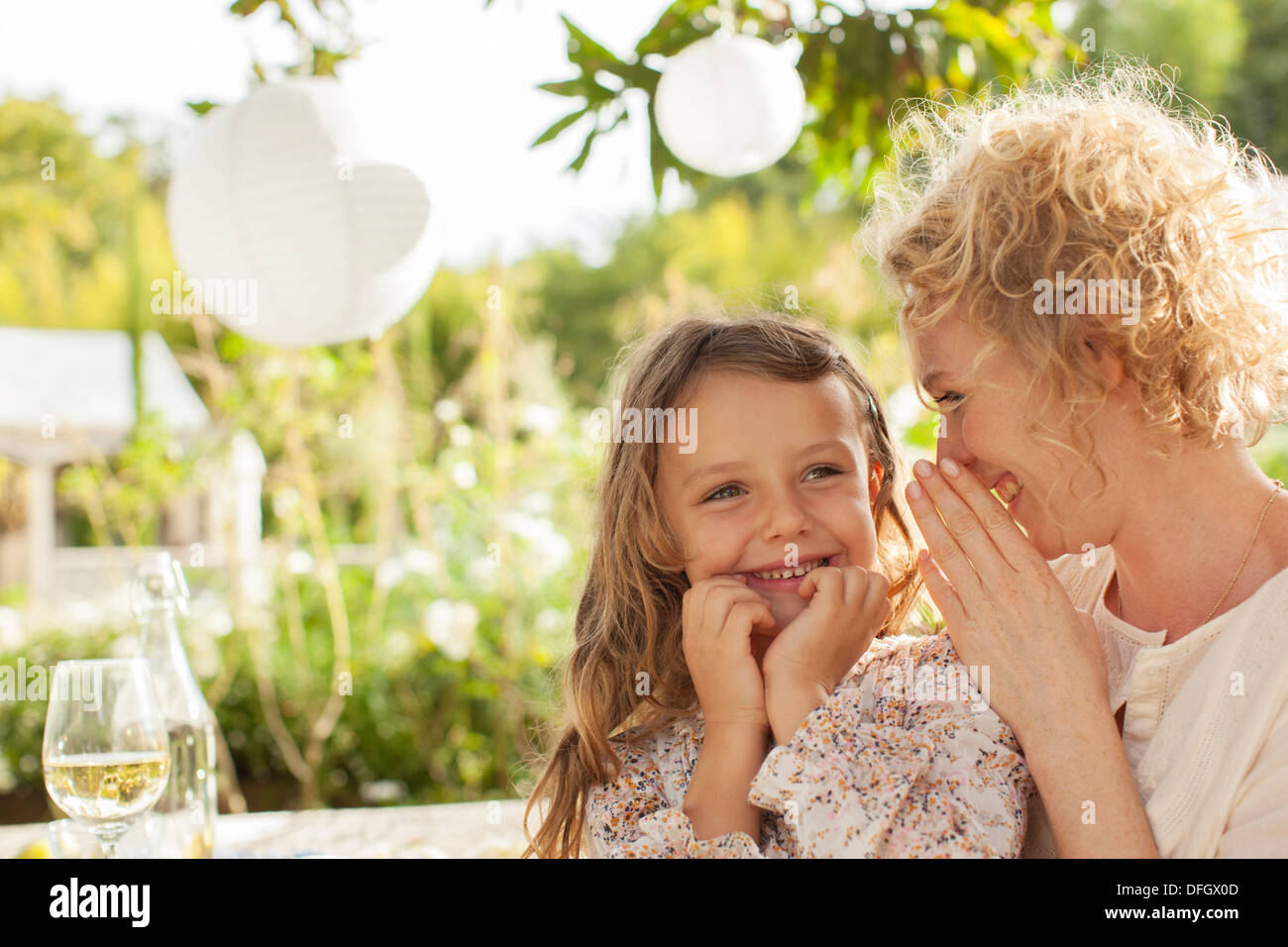 Children whispering hi-res stock photography and images - Alamy