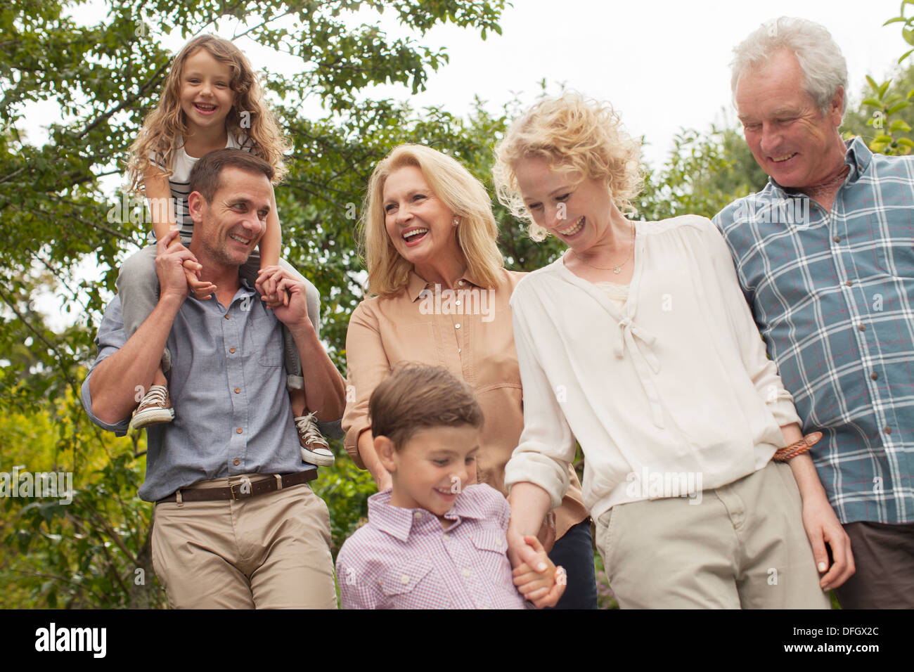 Multi-generation family walking together outdoors Stock Photo - Alamy