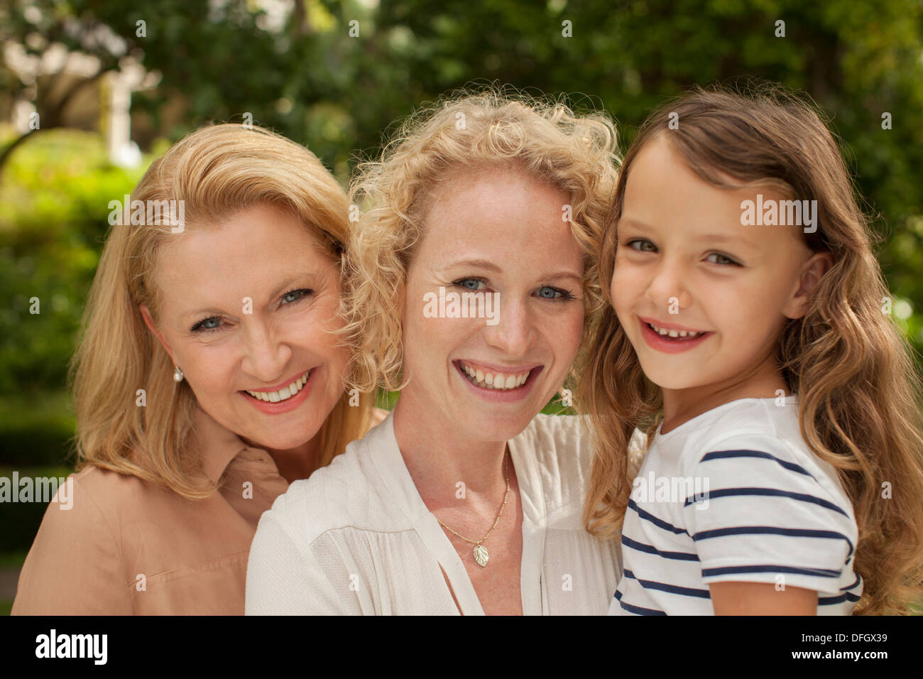 Three generations of women smiling outdoors Stock Photo - Alamy