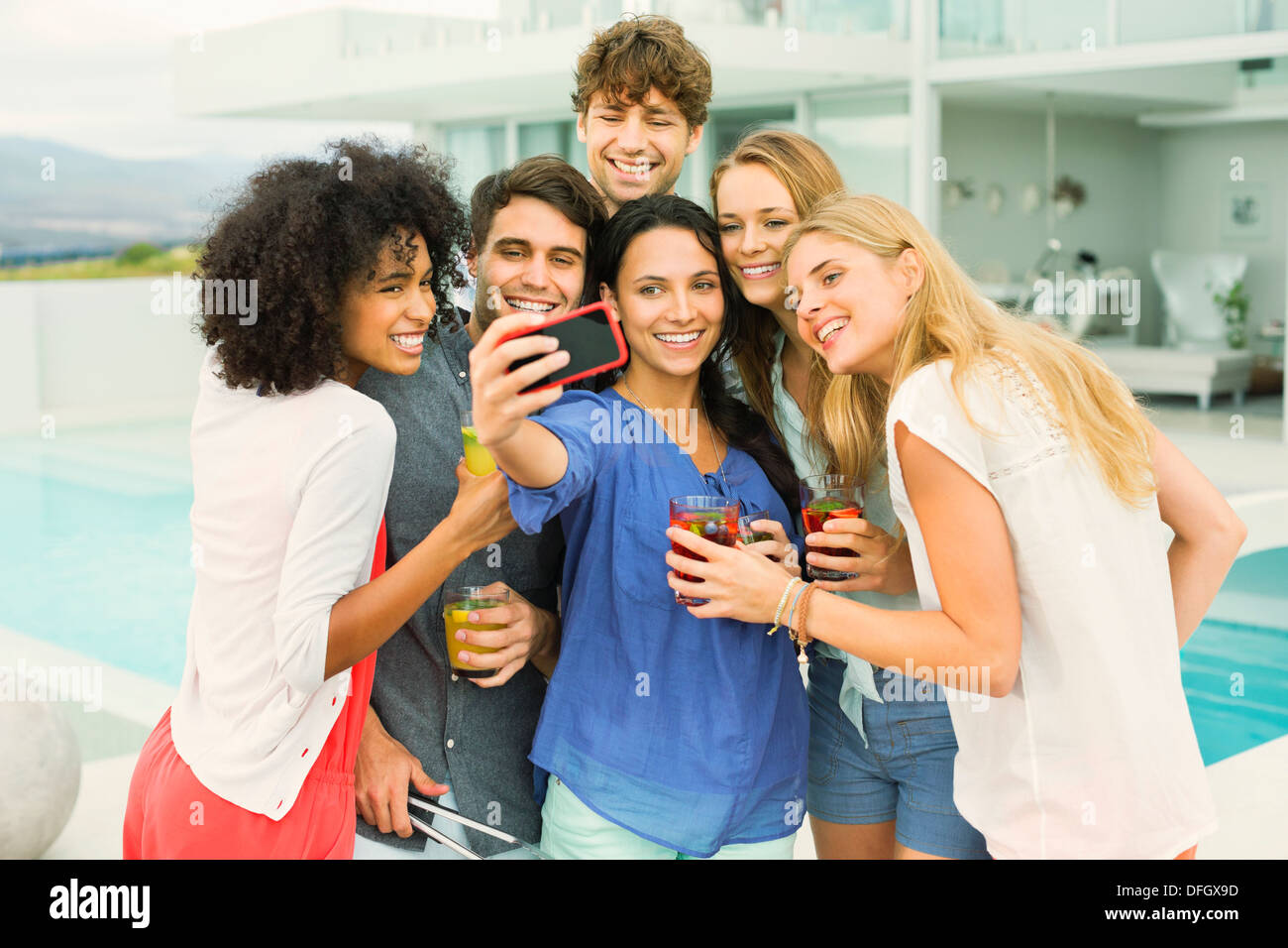 Friends taking picture together at party Stock Photo - Alamy