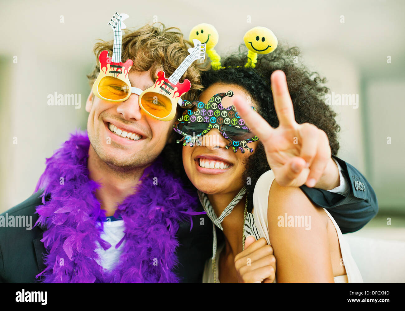 Couple wearing decorative glasses at party Stock Photo - Alamy