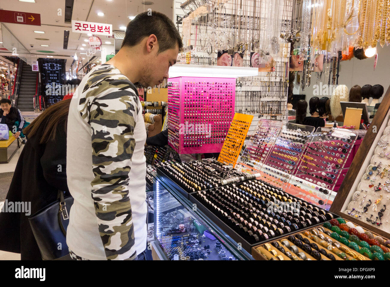 Young korean man looking at rings in Good Morning City Shopping Mall in ...