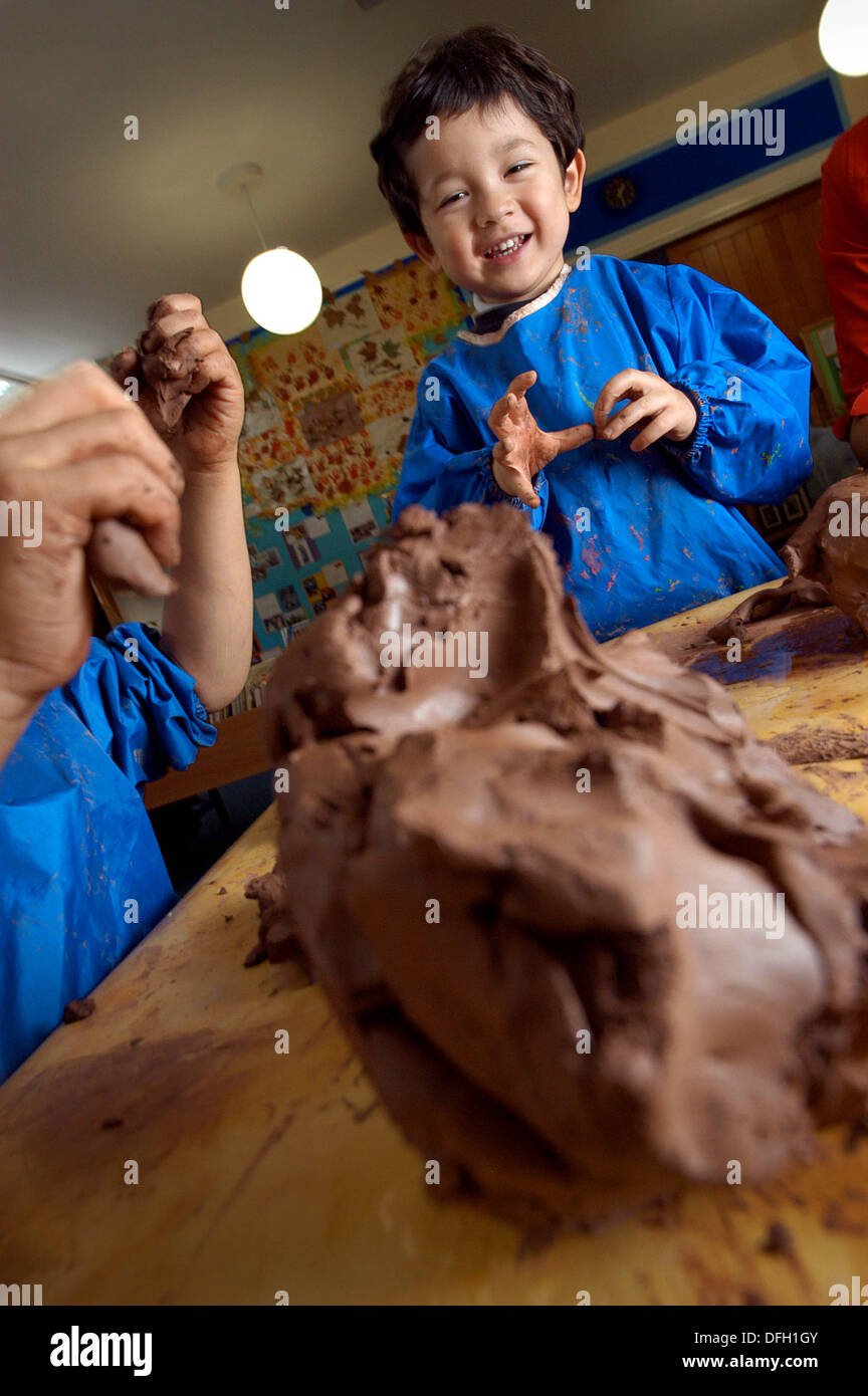 kids playing with clay at nursery Stock Photo - Alamy