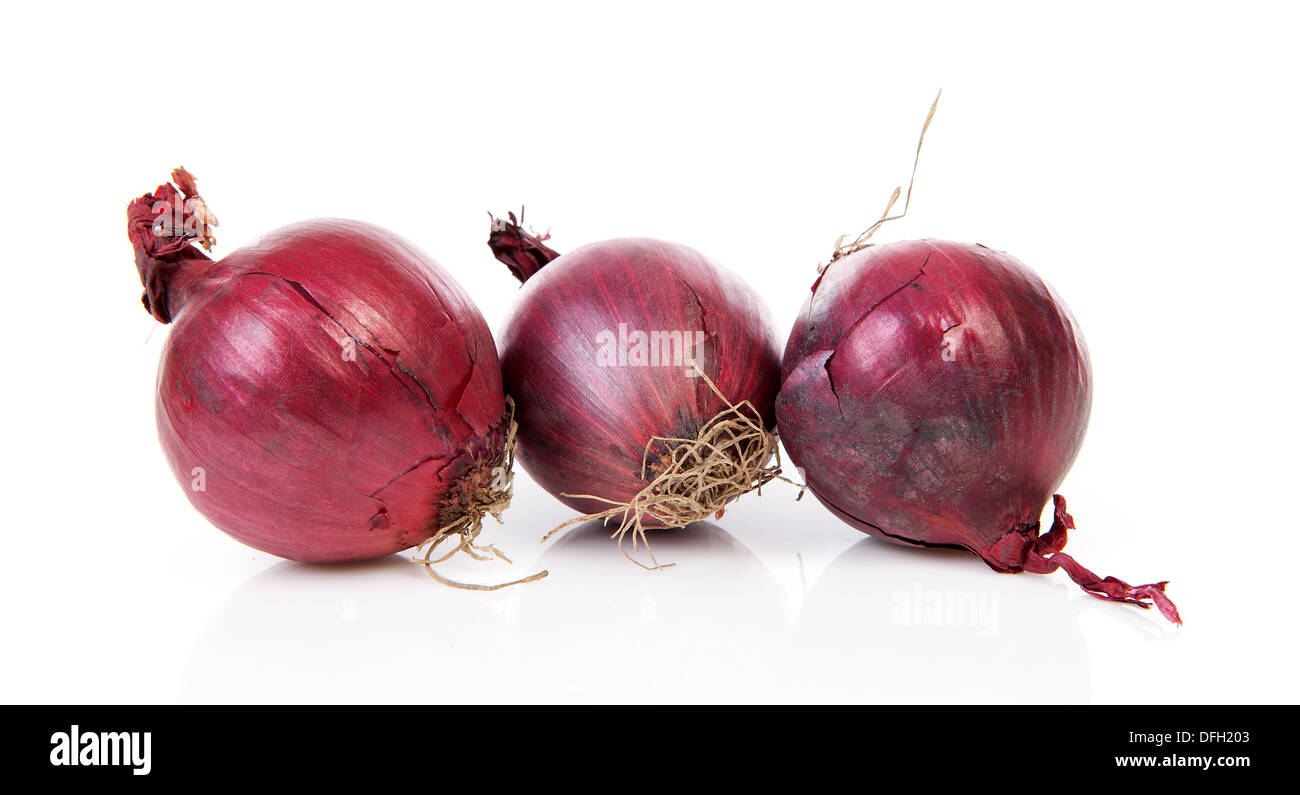 Three red onion isolated on white background Stock Photo - Alamy
