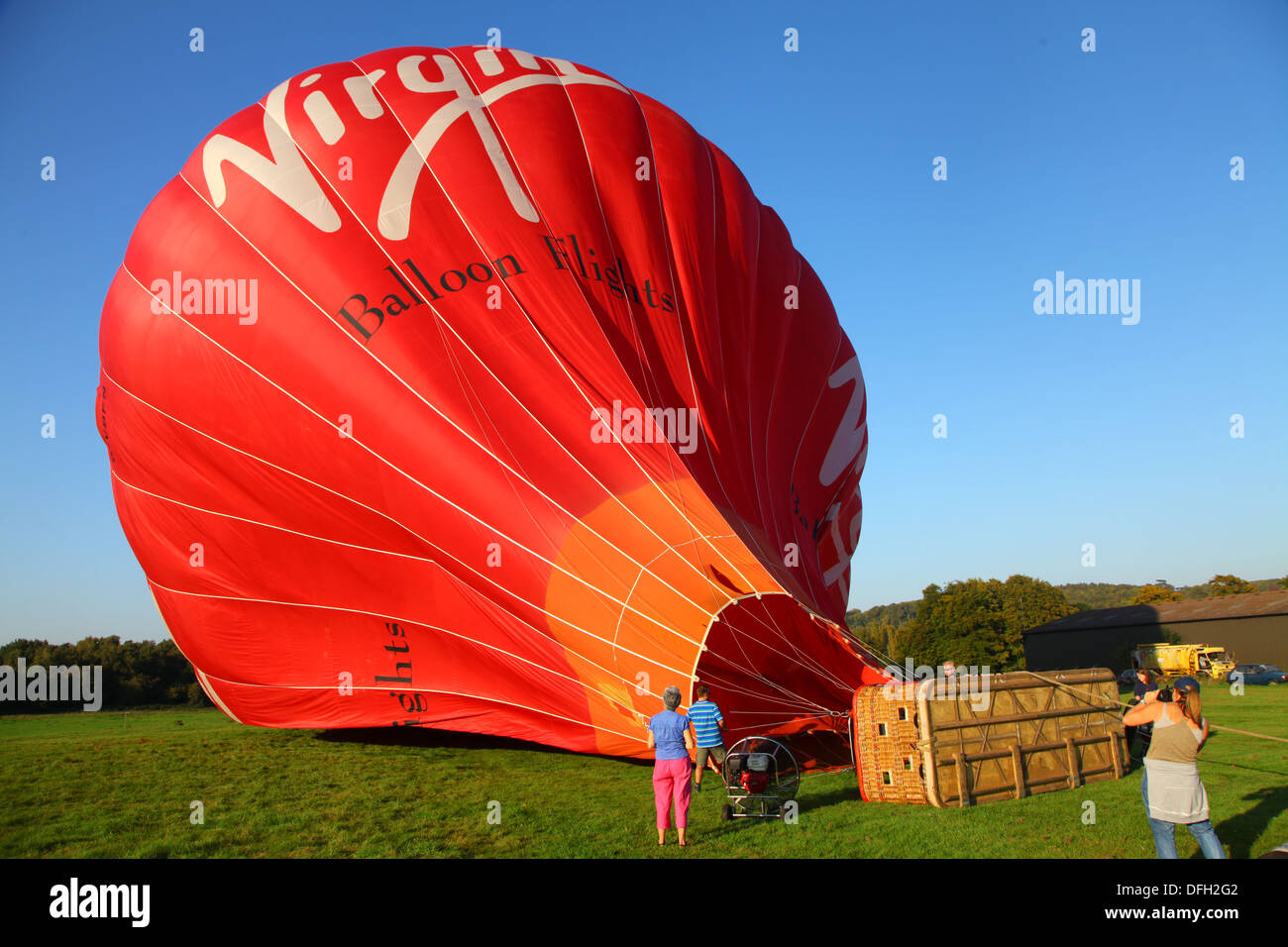 Inflating a hot air balloon on a Summer's day Stock Photo - Alamy