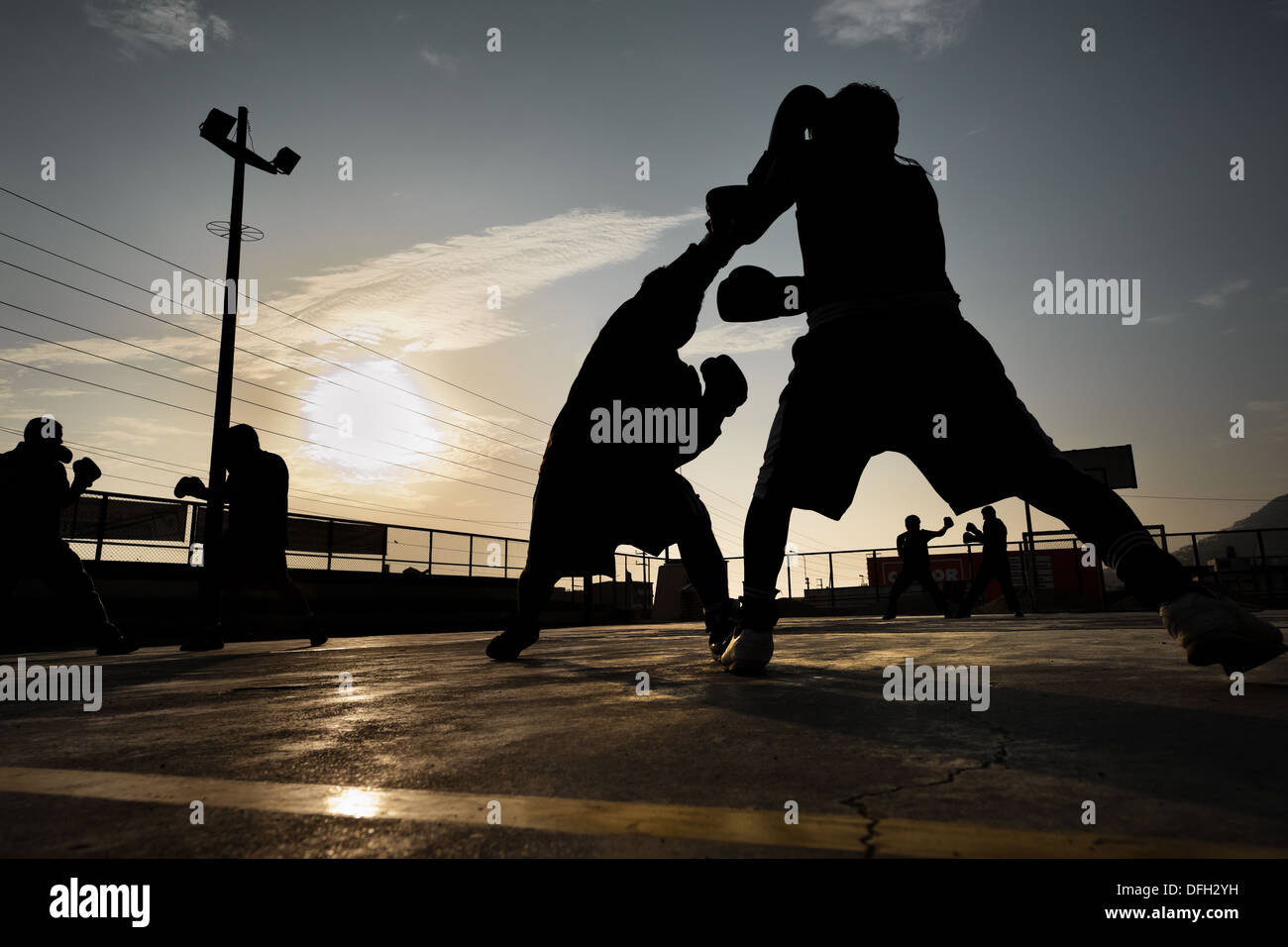 Peruvian youths practice boxing sparring at the Boxeo VMT boxing club ...