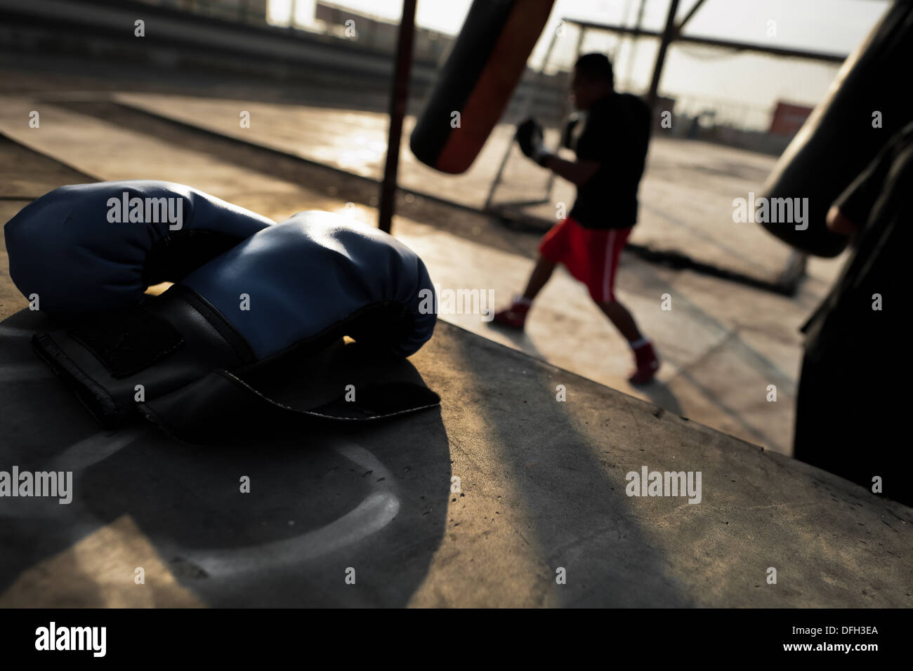 A Peruvian youth trains with a punching bag at the Boxeo VMT boxing ...