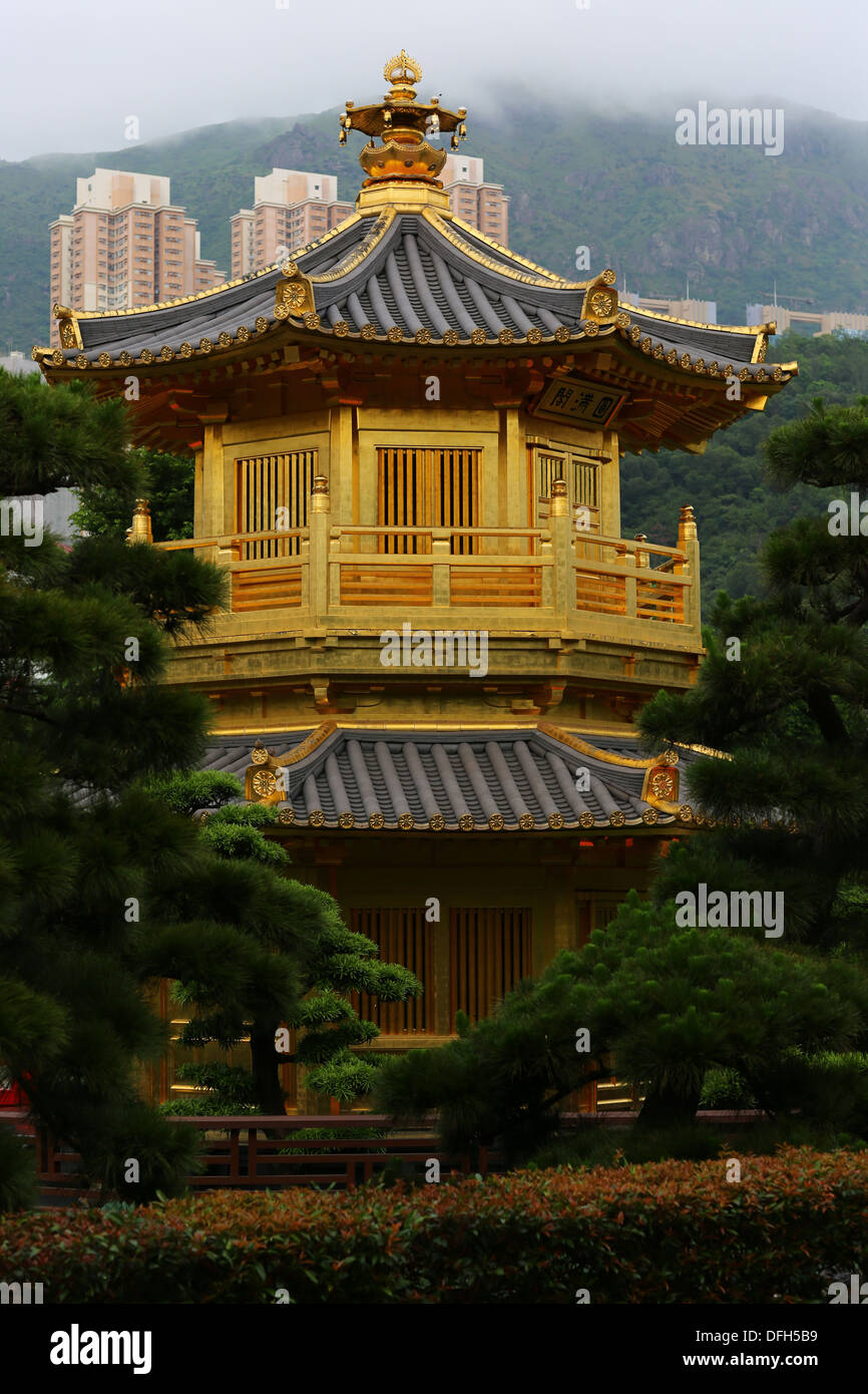 Chinese Pagoda in garden in Hong Kong with apartment blocks behind ...
