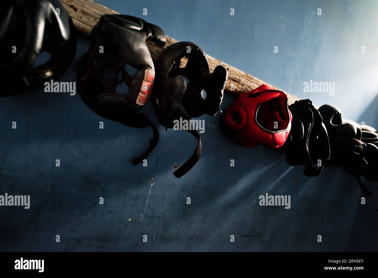 Boxing headgear hung on the rack in the boxing changing room of the ...