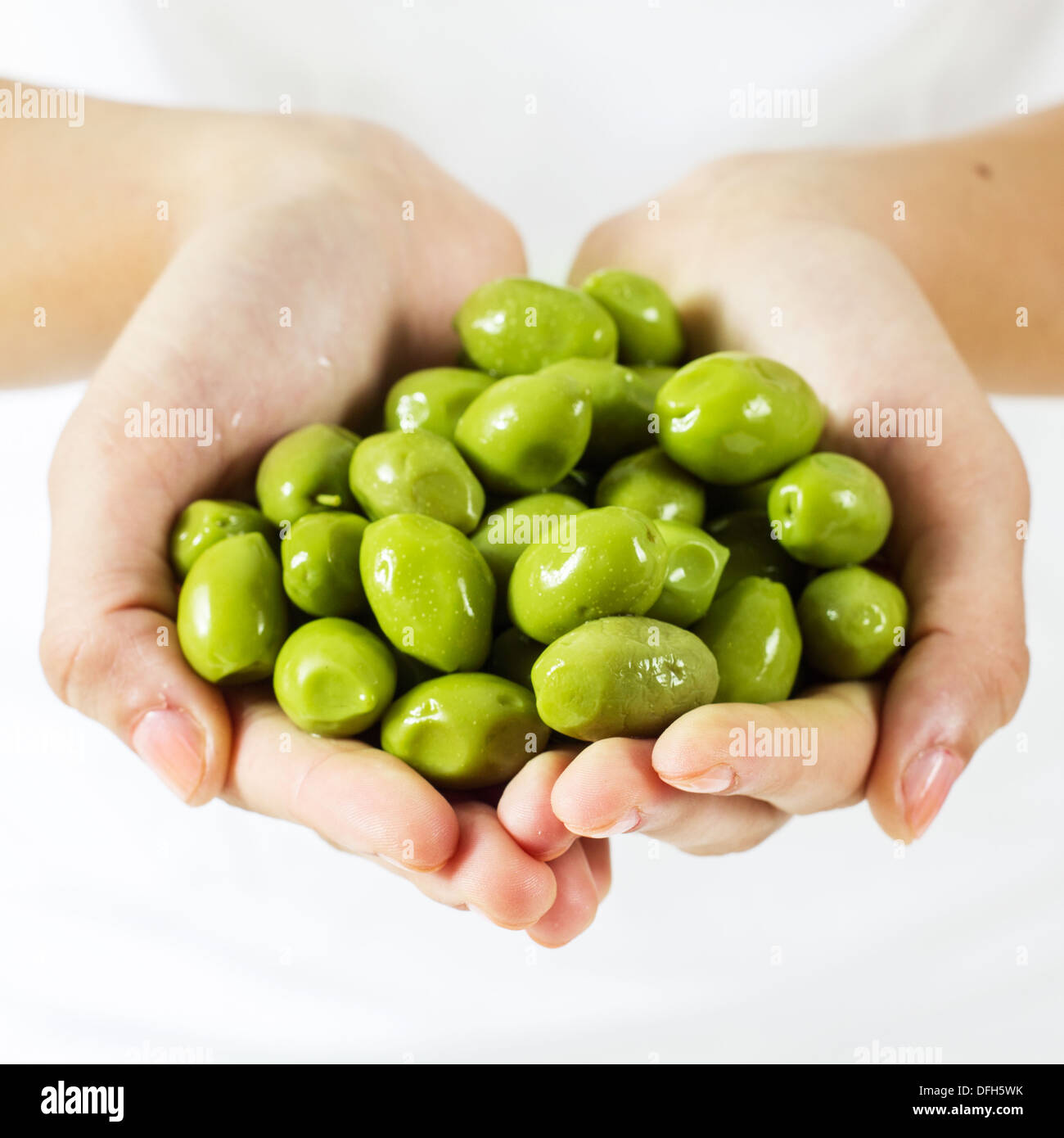 Healthy food green olive in human hands Stock Photo - Alamy